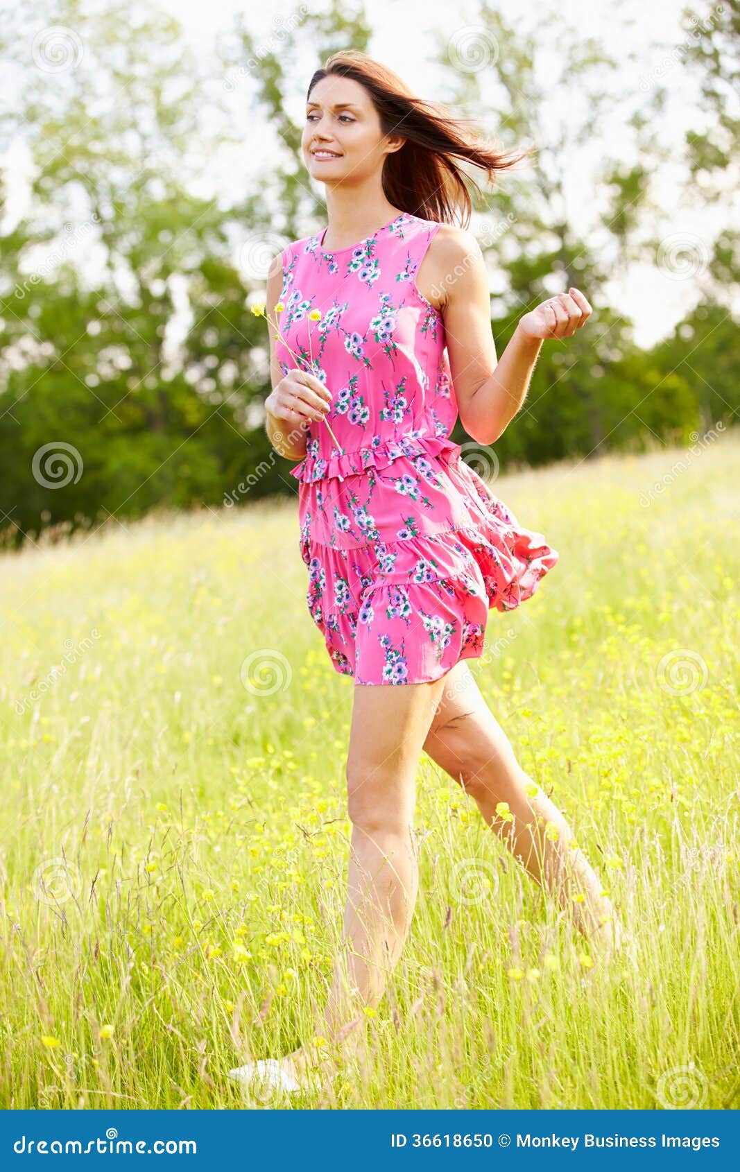 Attractive Woman Running through Field Stock Photo - Image of healthy ...