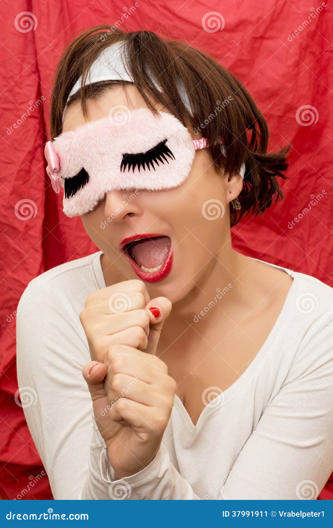Attractive Woman in Sleeping Mask Imitates Singing into a Microphone ...