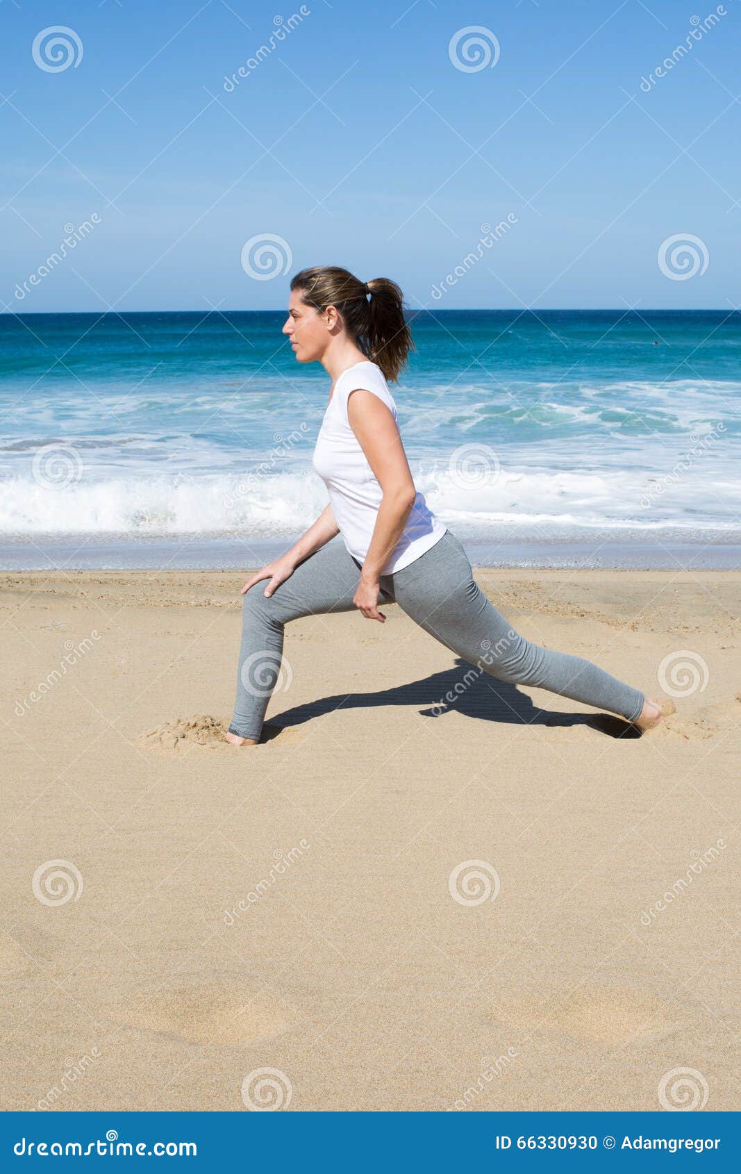 Attractive Woman Stretches on Beach Stock Photo - Image of vacation ...