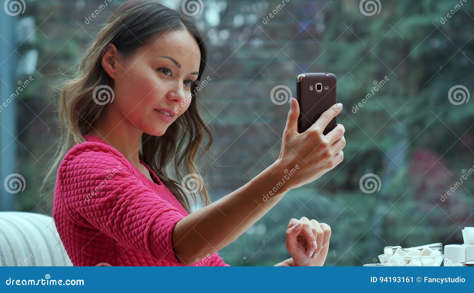 Attractive Woman Taking Self Portrait By Mobile Phone In Cafe Stock