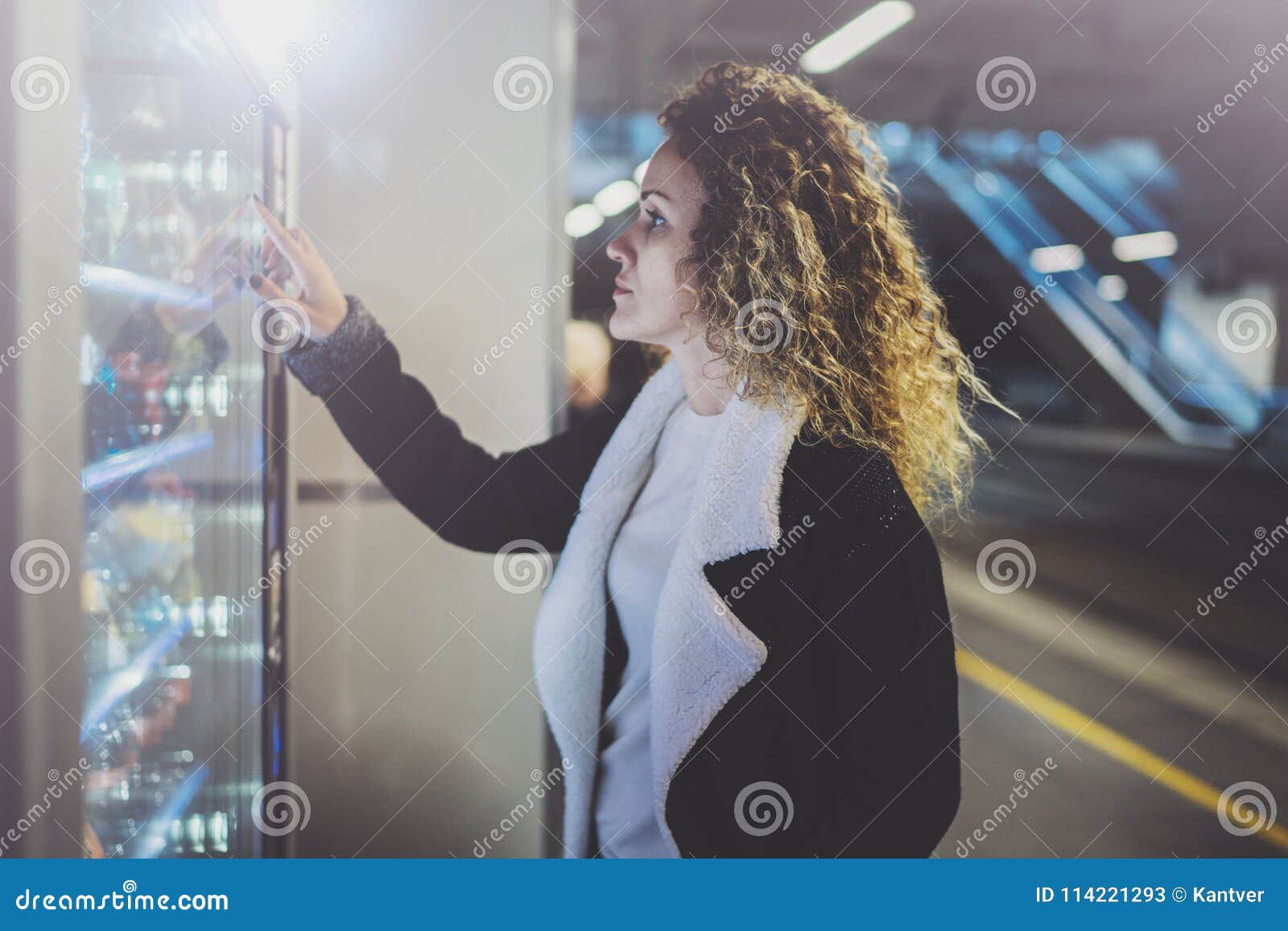 Attractive Woman on Transit Platform Using a Modern Beverage Vending ...