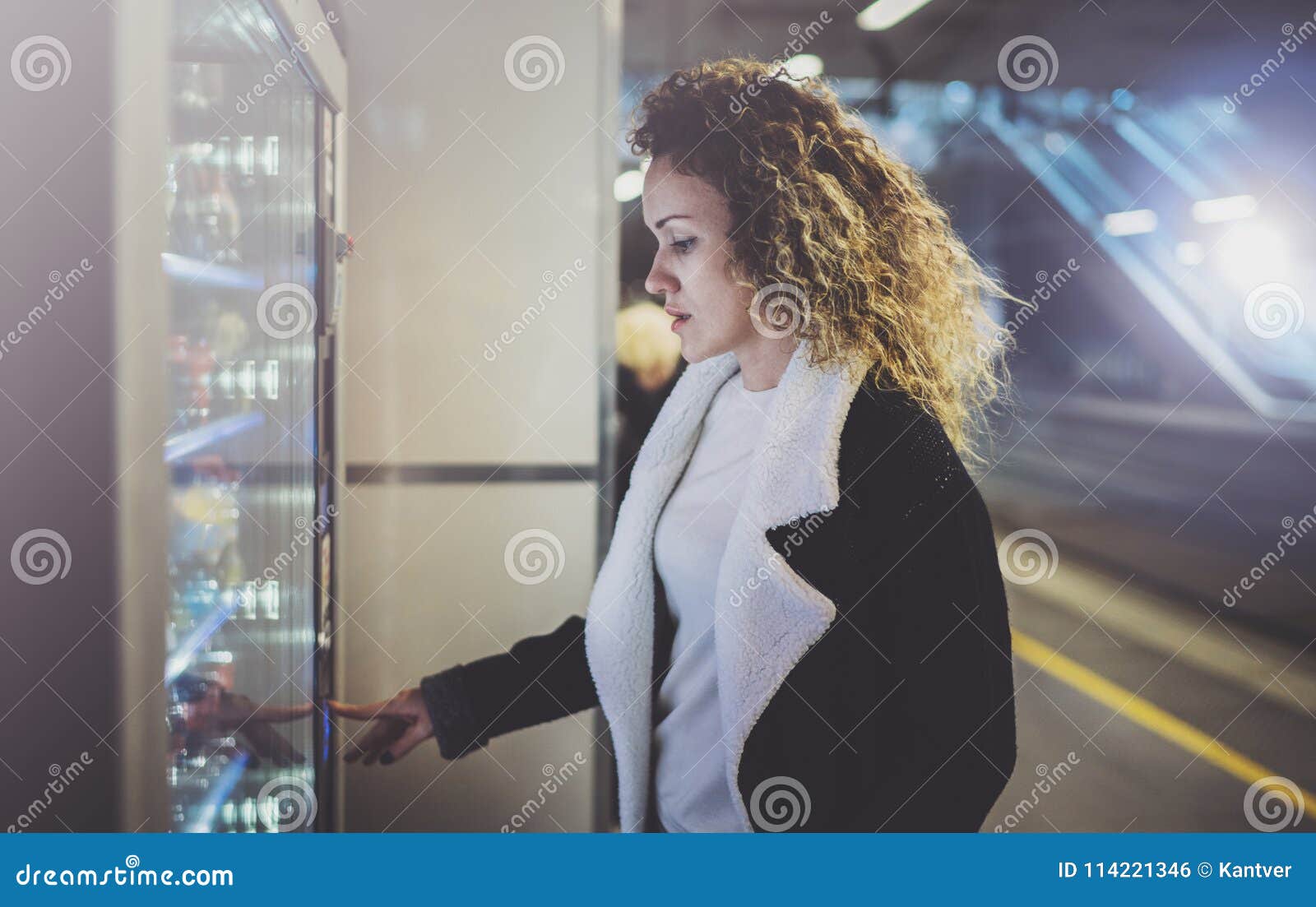 Attractive Woman on Transit Platform Using a Modern Beverage Vending ...