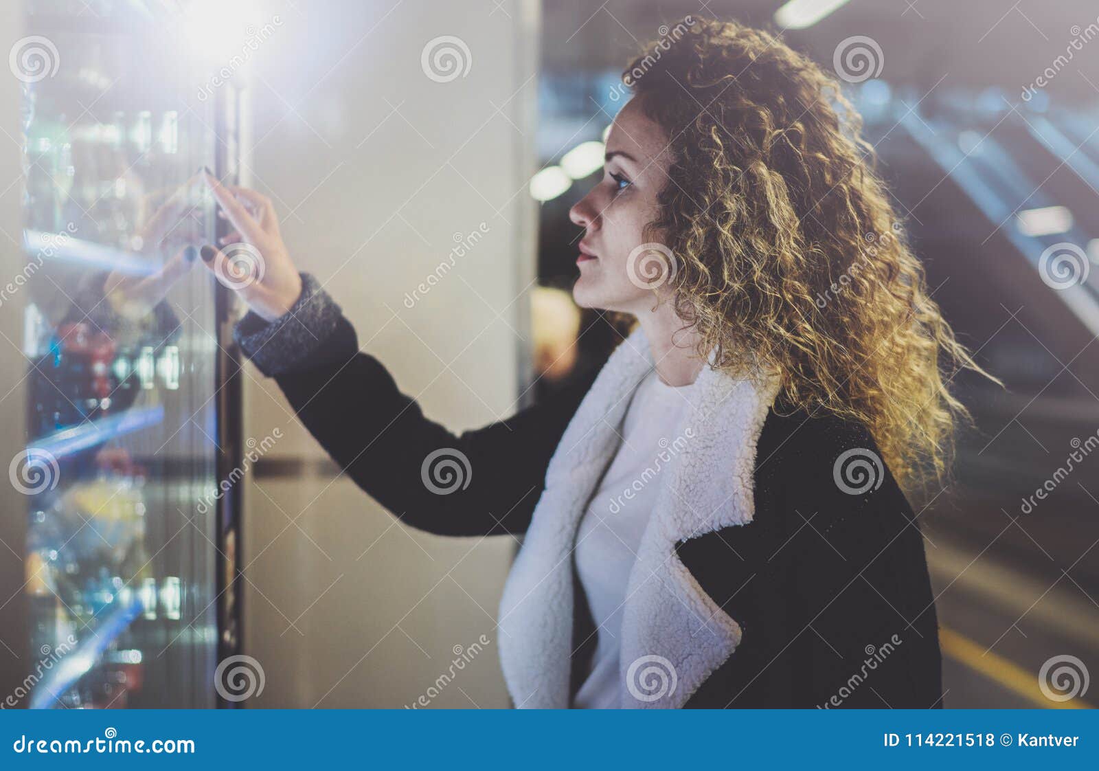 Attractive Woman On Transit Platform Using A Modern Beverage Vending ...