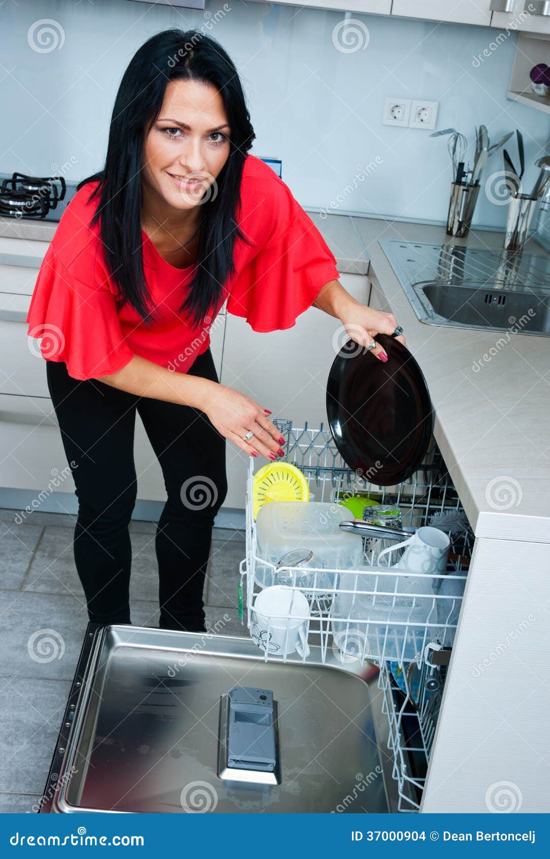Attractive Woman Using Dishwasher Stock Photo - Image of dishware ...