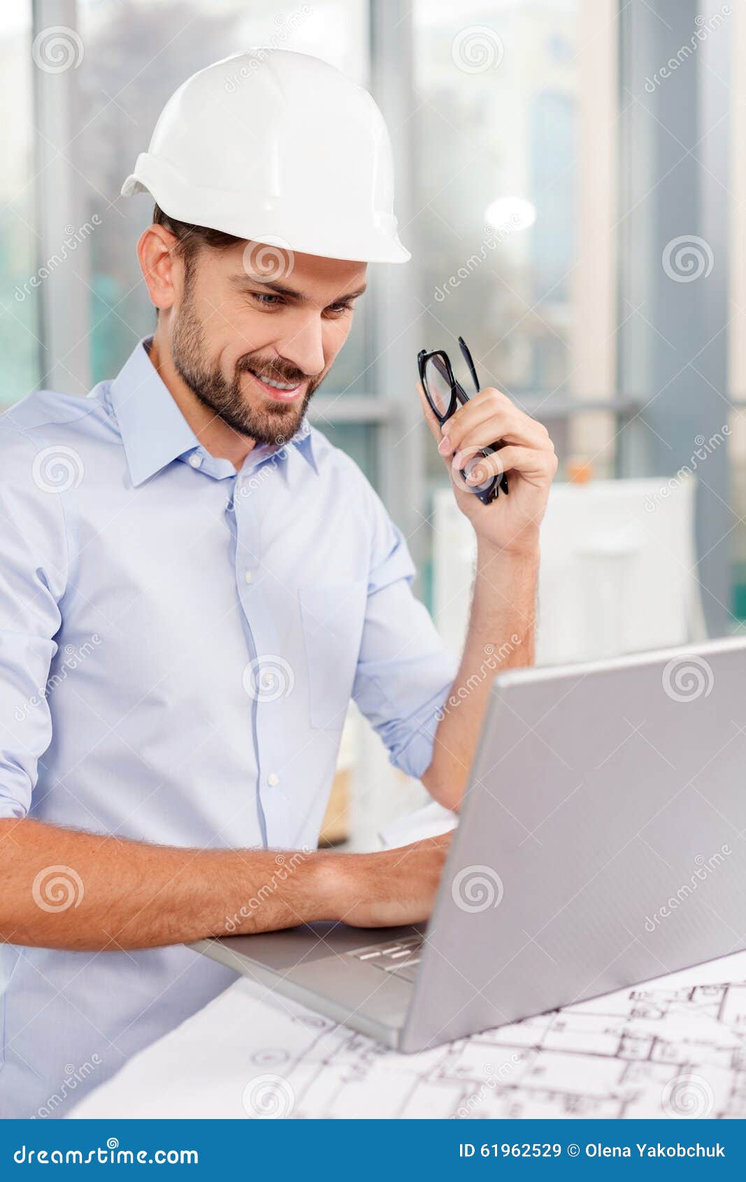 Attractive Young Architect is Using the Laptop Stock Image - Image of ...