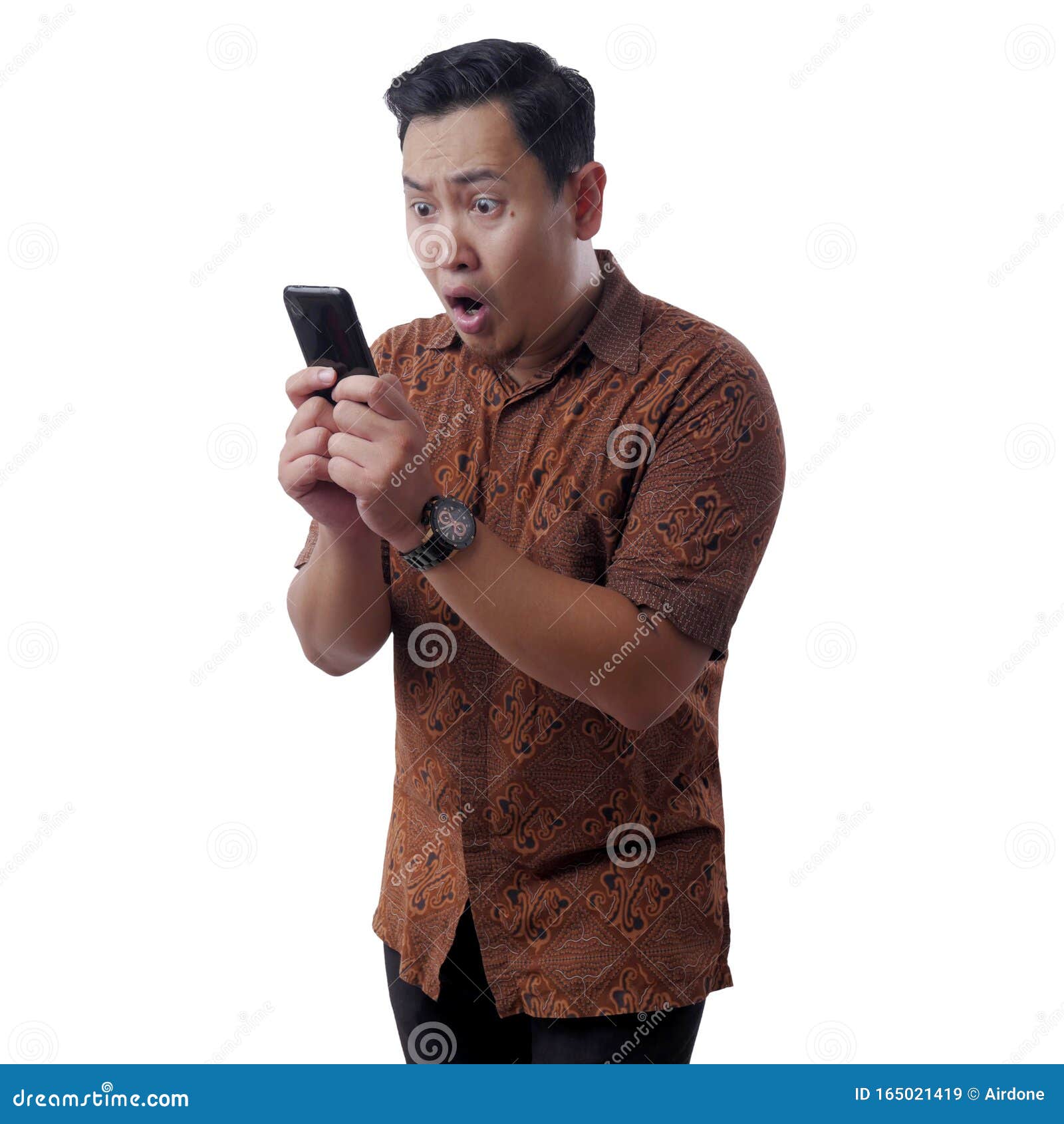 Young Man Texting Reading Chatting On His Phone Shocked Worried Gesture