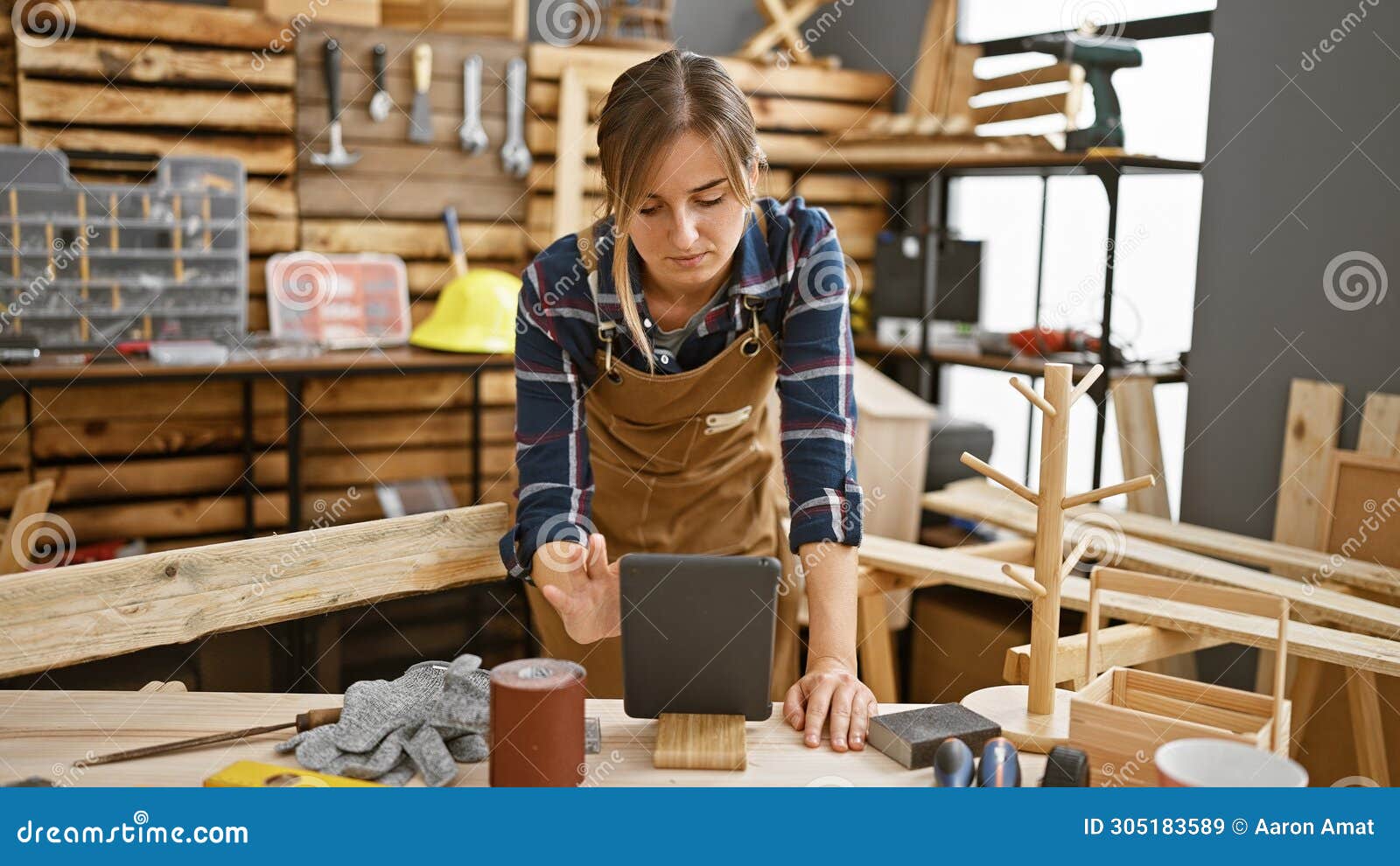 Attractive Young Blonde Female Carpenter Immersed in Her Craft ...