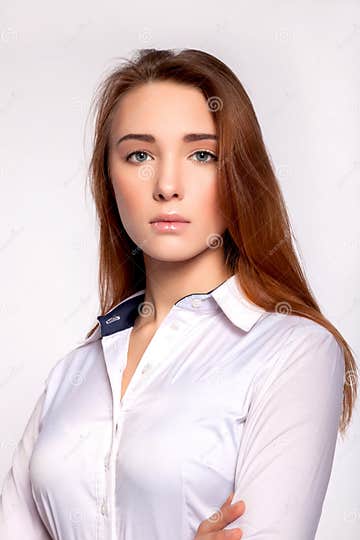 Attractive Young Brunette Businesswoman With Her Arms Crossed Stock