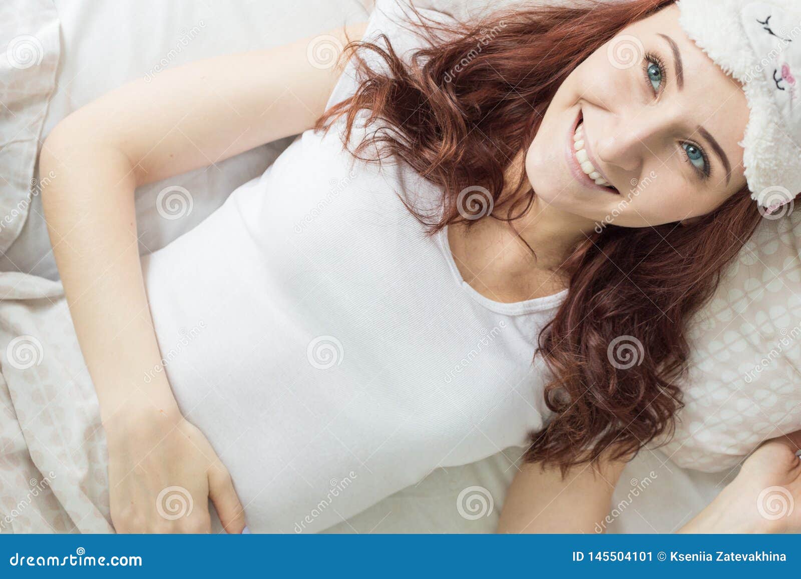 An Attractive Young Brunette Girl Woman Wakes Up In Her Bed In A Sleep