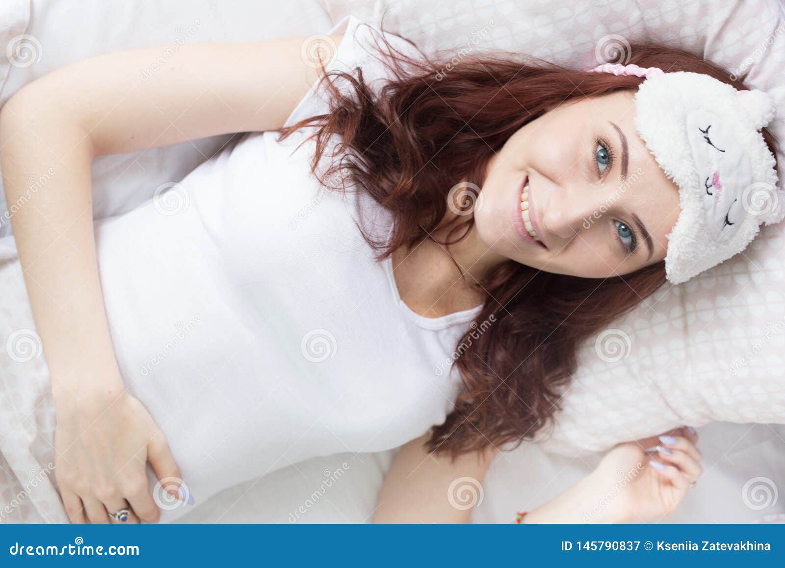An Attractive Young Brunette Girl Woman Wakes Up In Her Bed In A Sleep