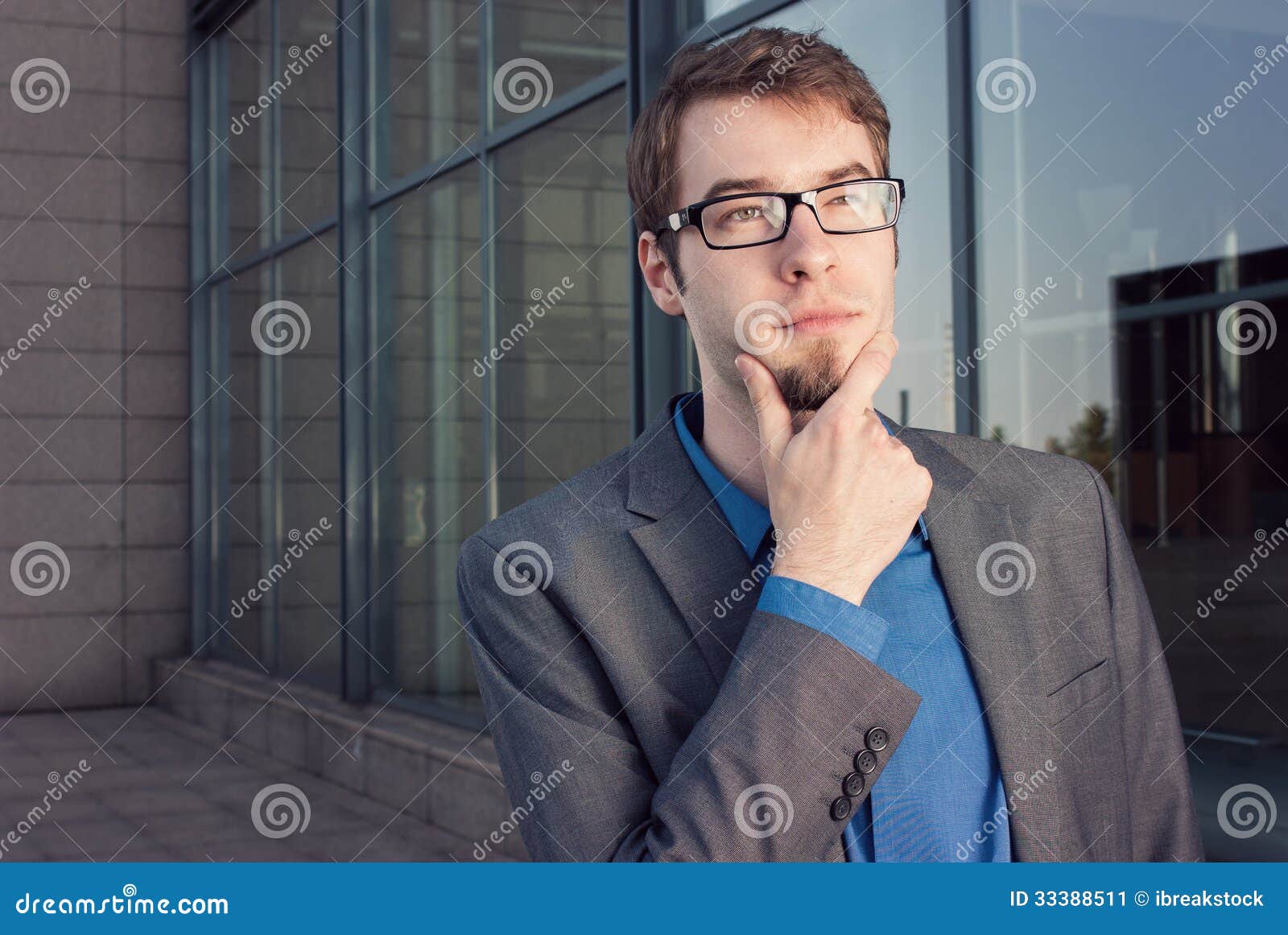 Attractive Young Businessman Thinking Stock Image - Image of suit ...
