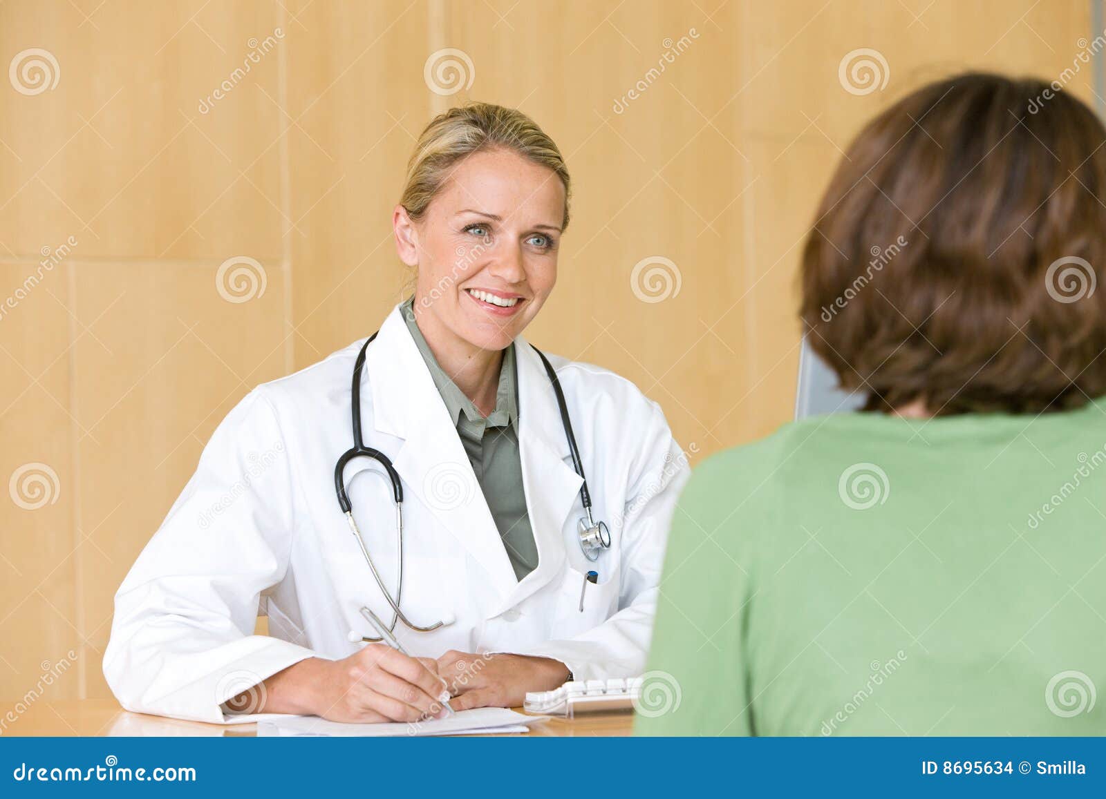 Attractive Young Caring Doctor Stock Photo - Image of coat, clinic: 8695634