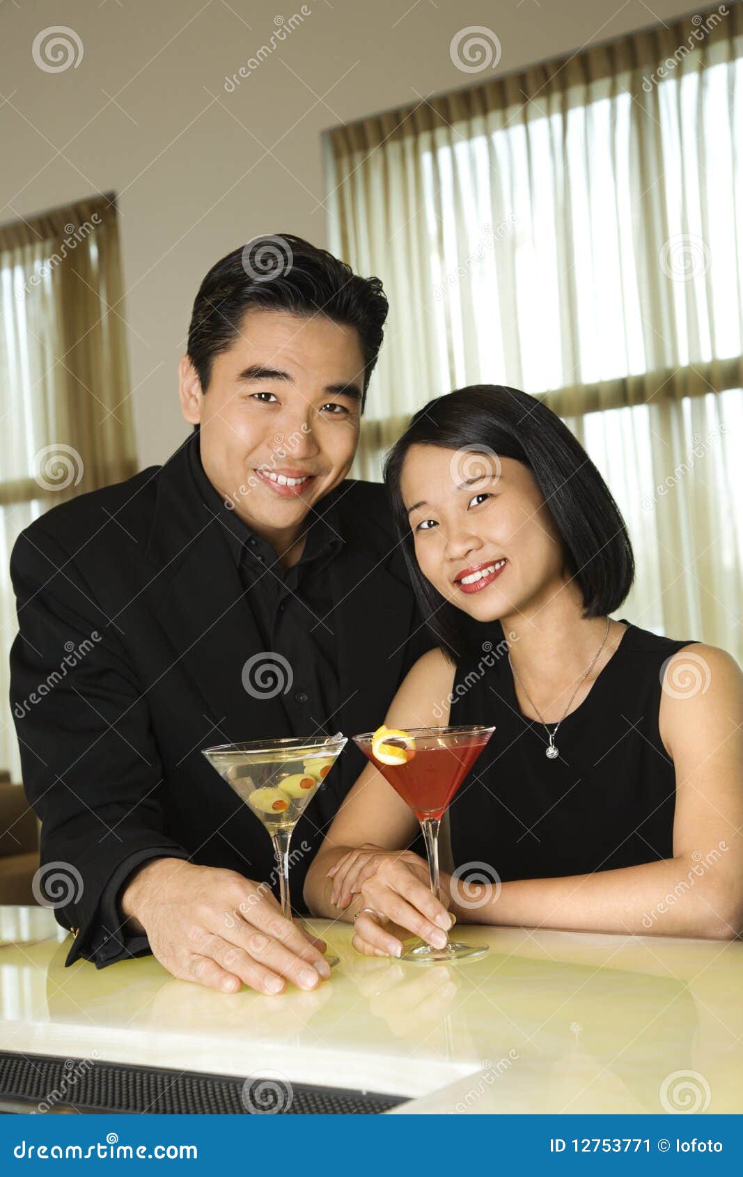 Attractive Young Couple with Cocktails Smiling Stock Image - Image of ...