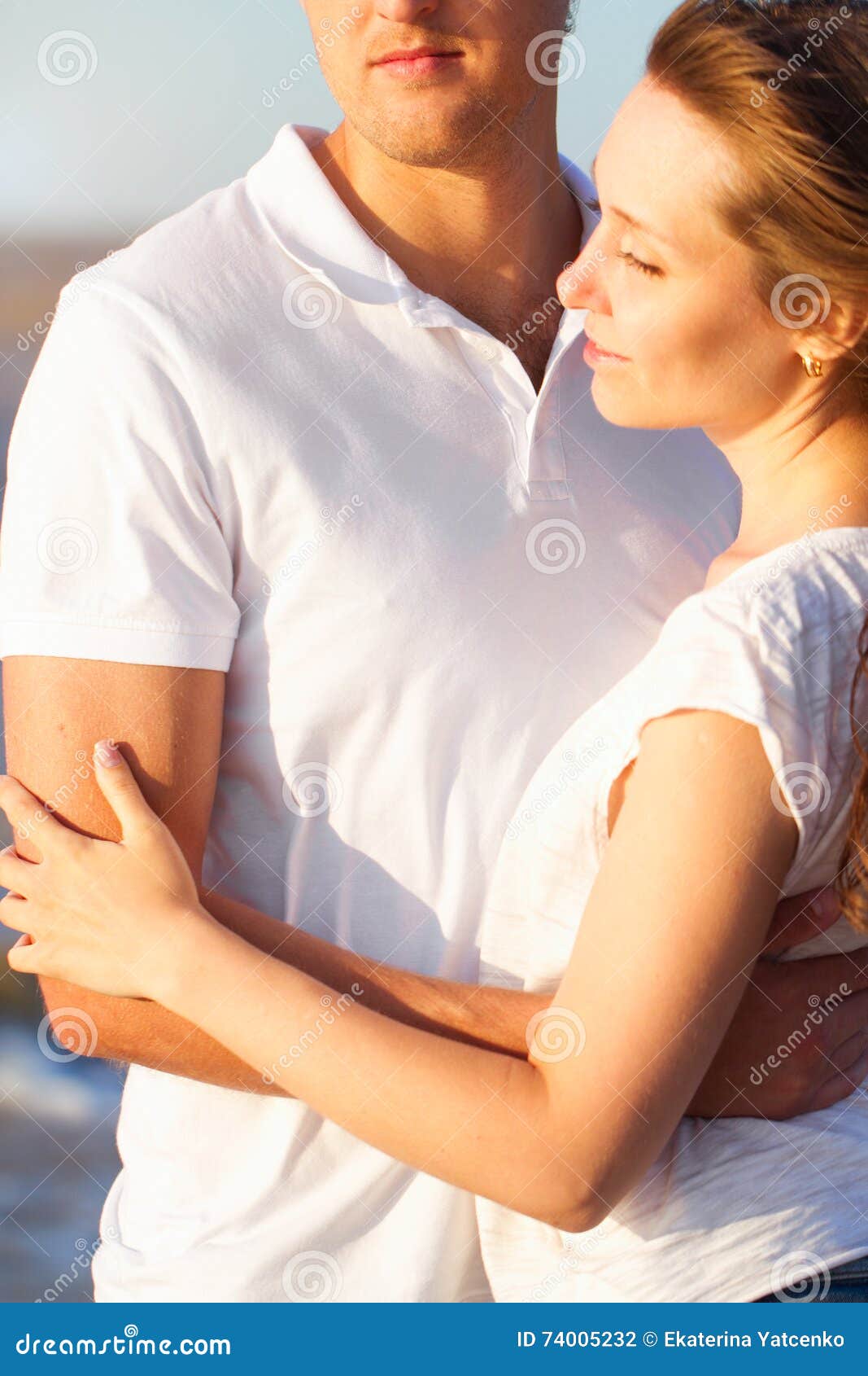Attractive Young Couple Cuddling at the Beach. Close Up Stock Photo ...