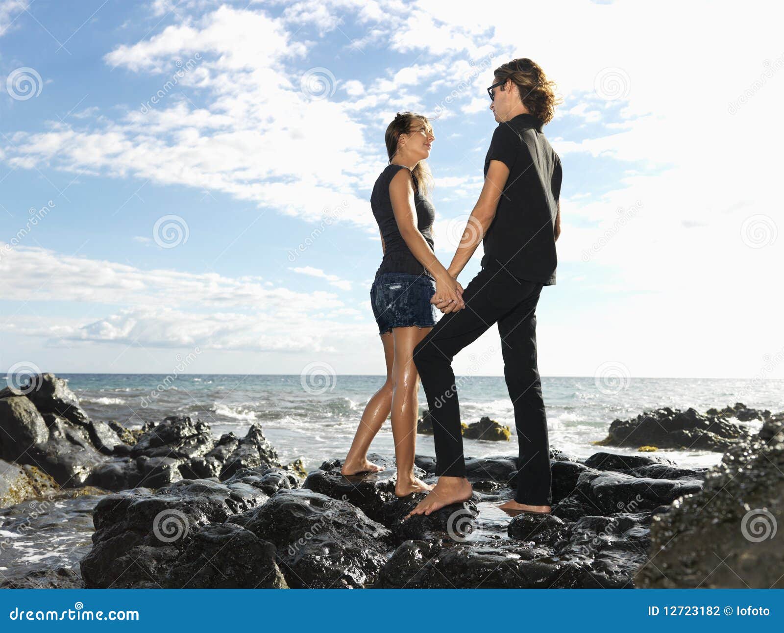 Attractive Young Couple on Rocks Stock Photo - Image of beach, ocean ...