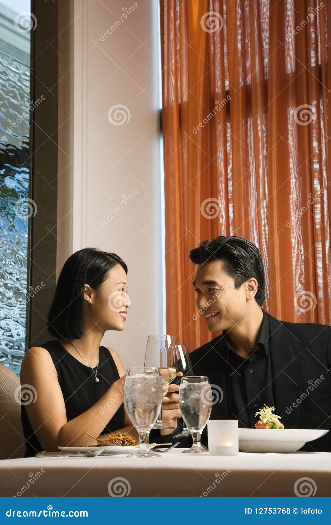 Attractive Young Couple Smiling at Each Other Stock Photo - Image of ...