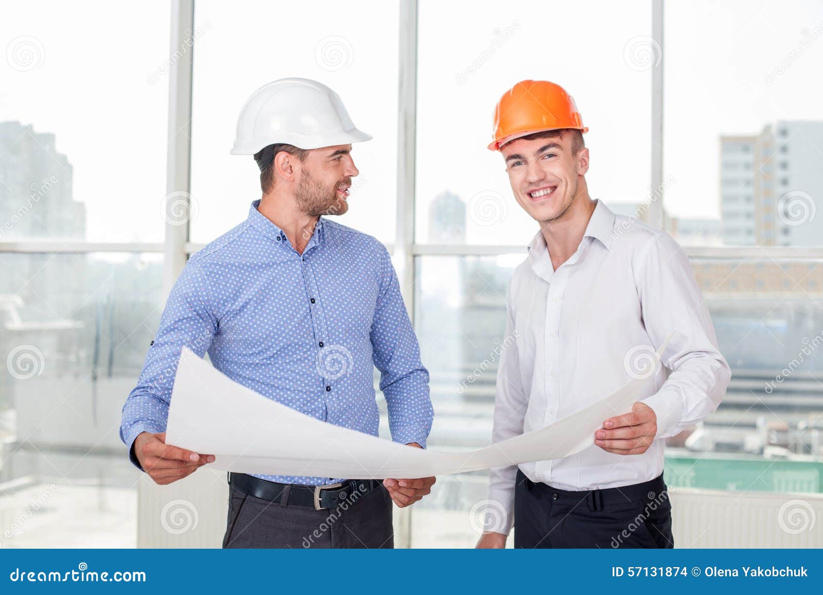 Attractive Young Engineer is Explaining the Plan Stock Photo - Image of ...