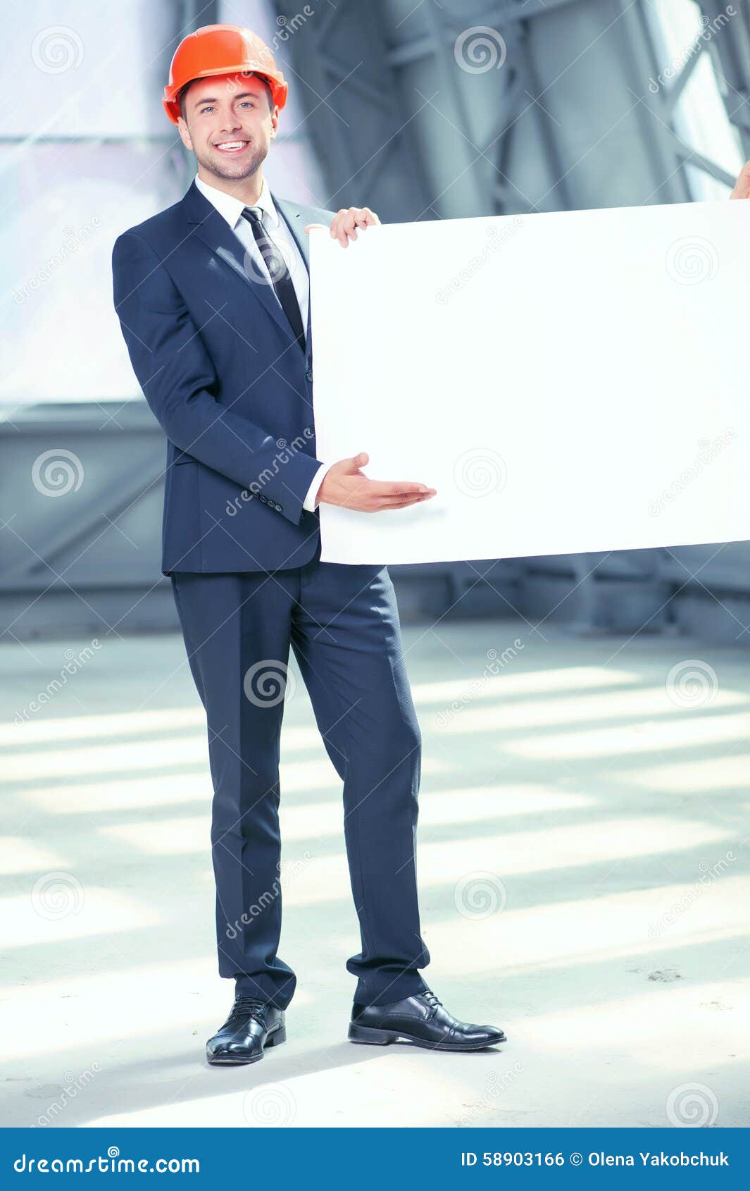 Attractive Young Engineer is Showing the New Stock Photo - Image of ...