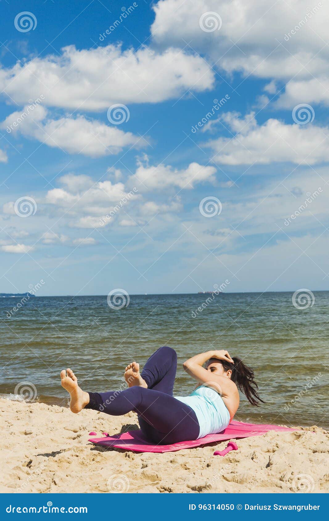 Attractive Young Girl Practicing Physical Exercises on a Beach in the ...