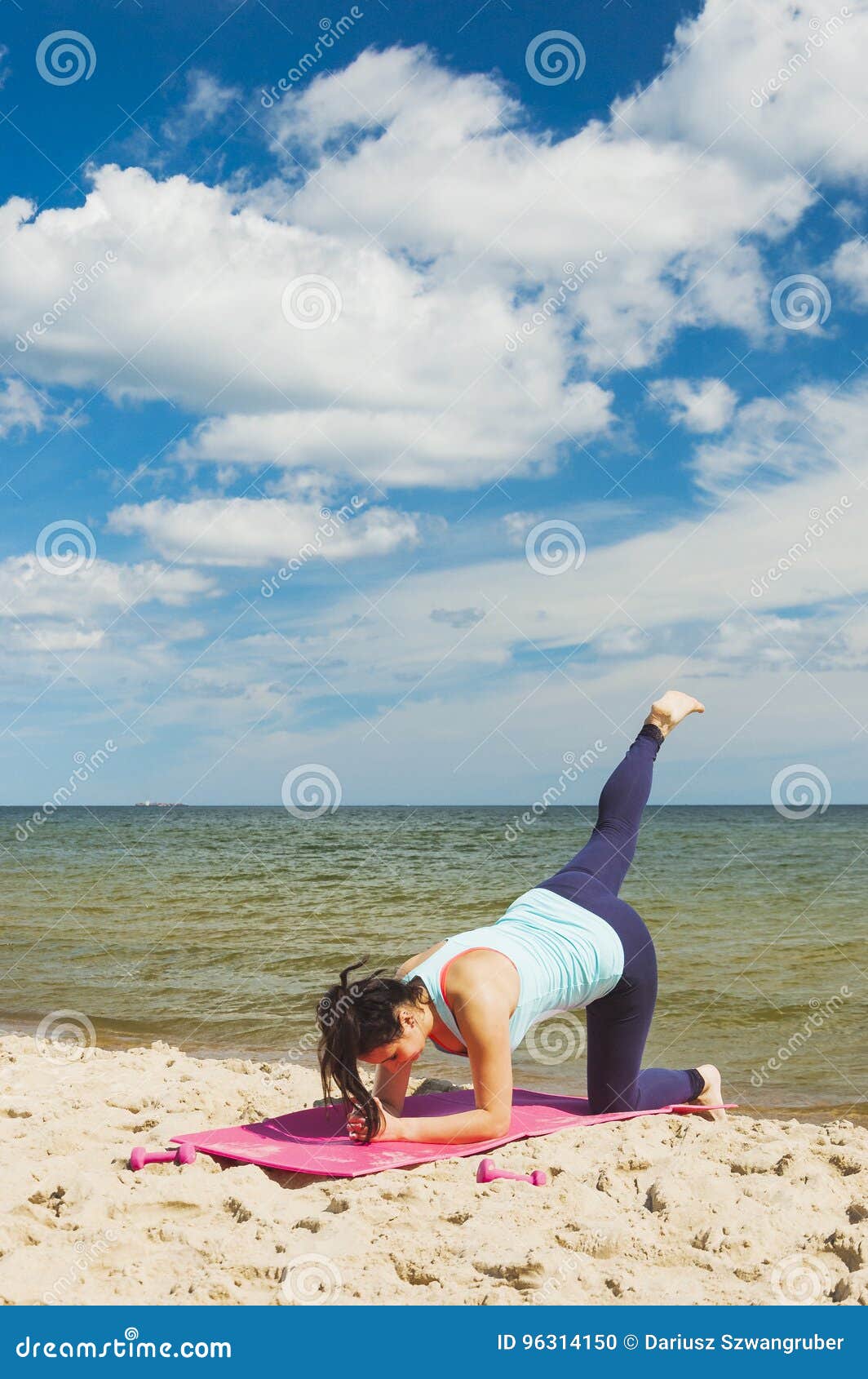 Attractive Young Girl Practicing Physical Exercises on a Beach in the ...