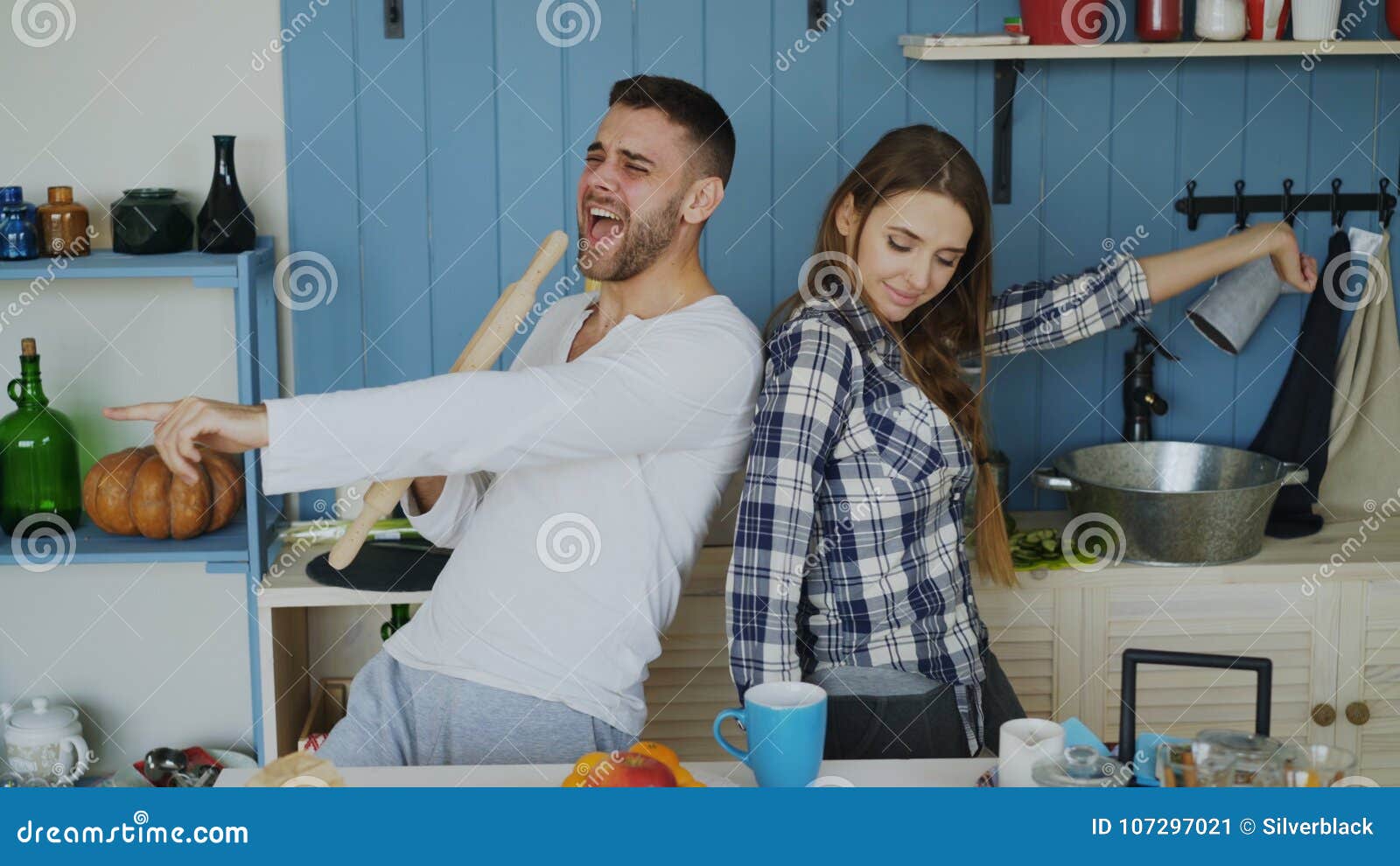 Young Joyful Couple Have Fun Dancing and Singing while Set the Table ...