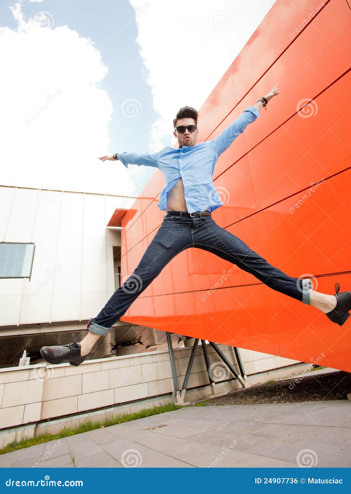 Attractive Young Male Model Jumping Outdoors Stock Photo - Image of ...