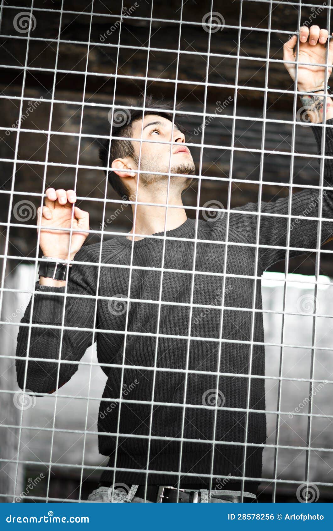 Attractive Young Man Behind Metal or Steel Net Stock Photo - Image of ...