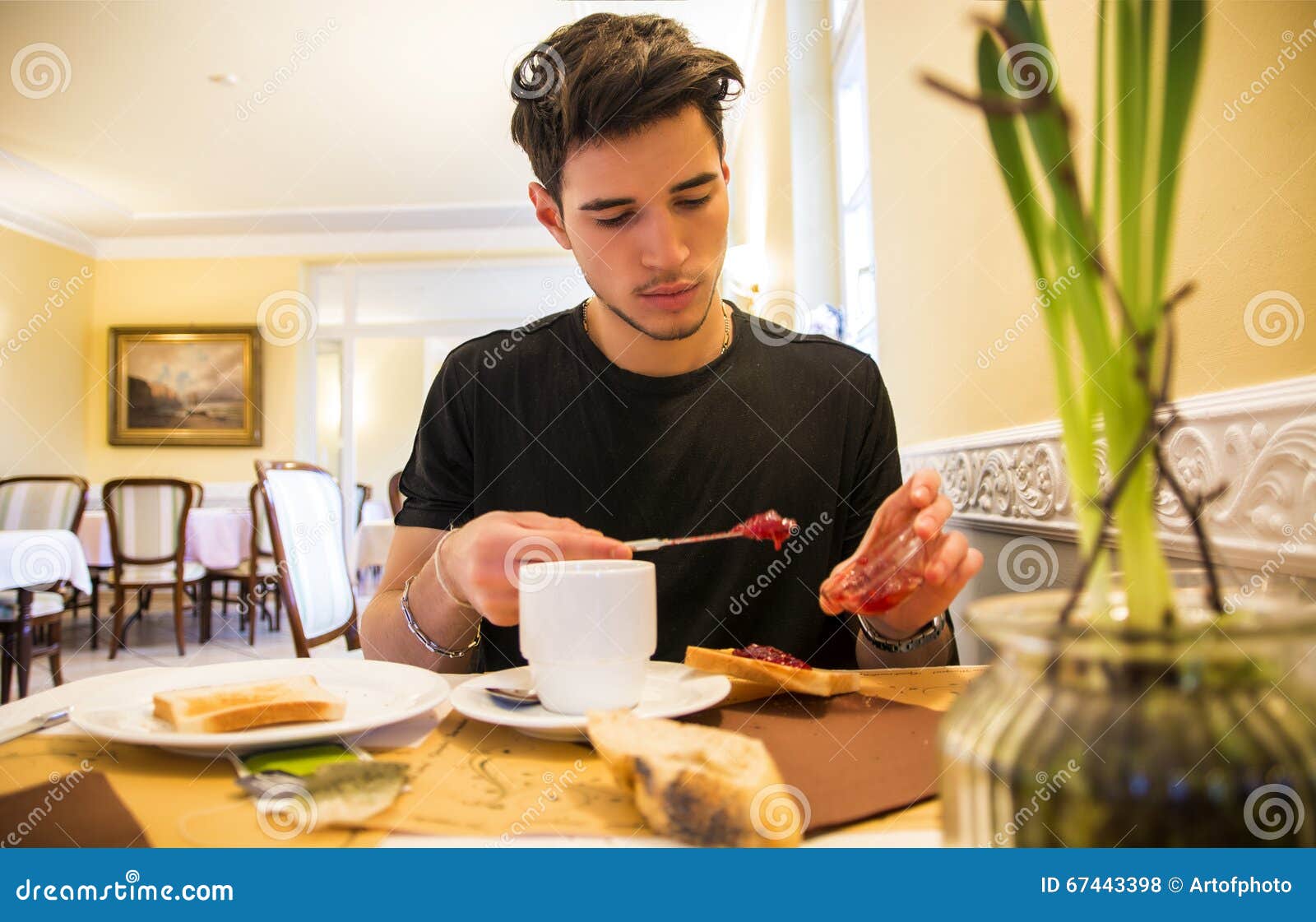 Attractive Young Man Eating Breakfast Stock Photo - Image of tired ...