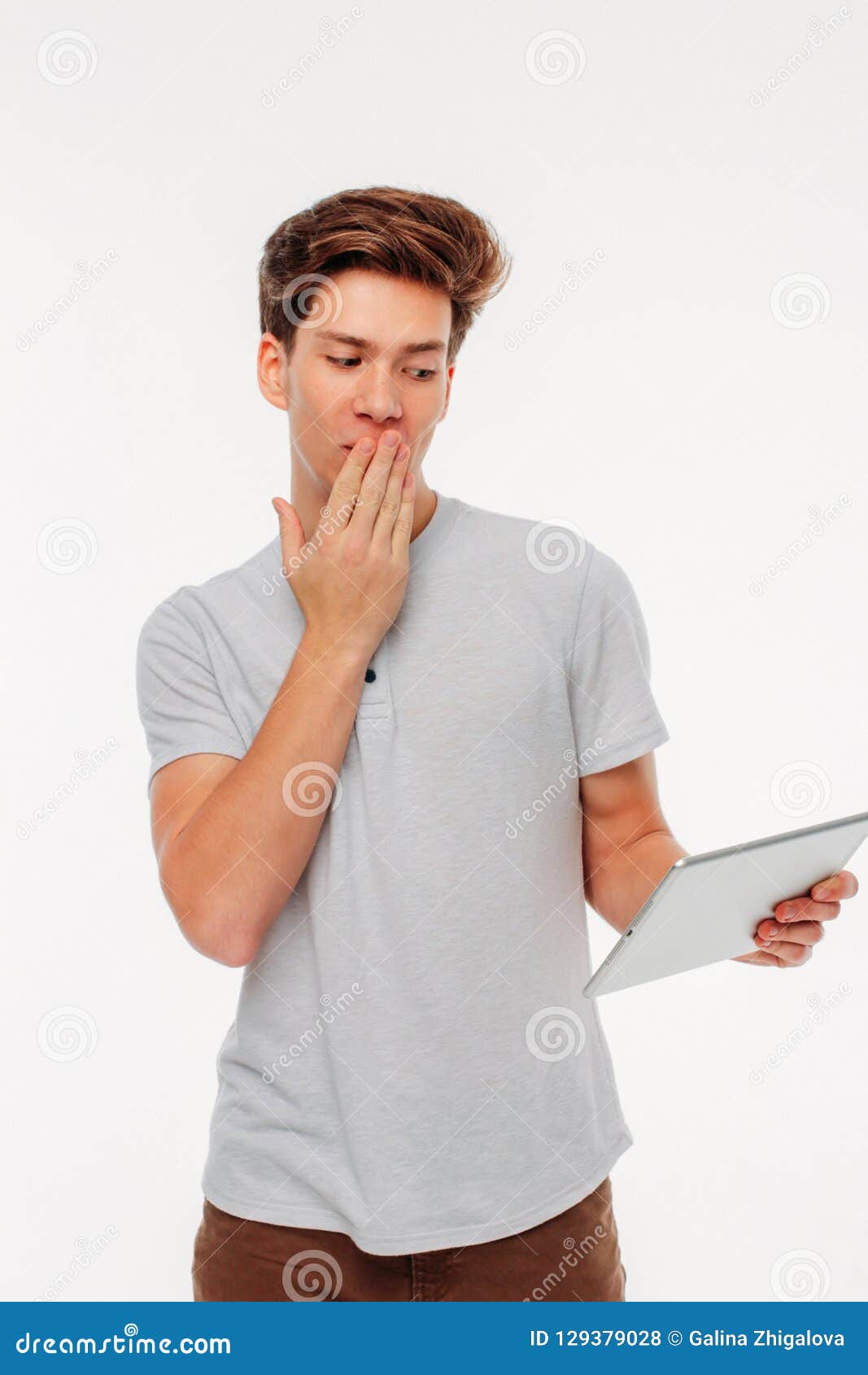 Attractive Young Man Holds Tablet in Hand, the Second Hand Close Stock ...
