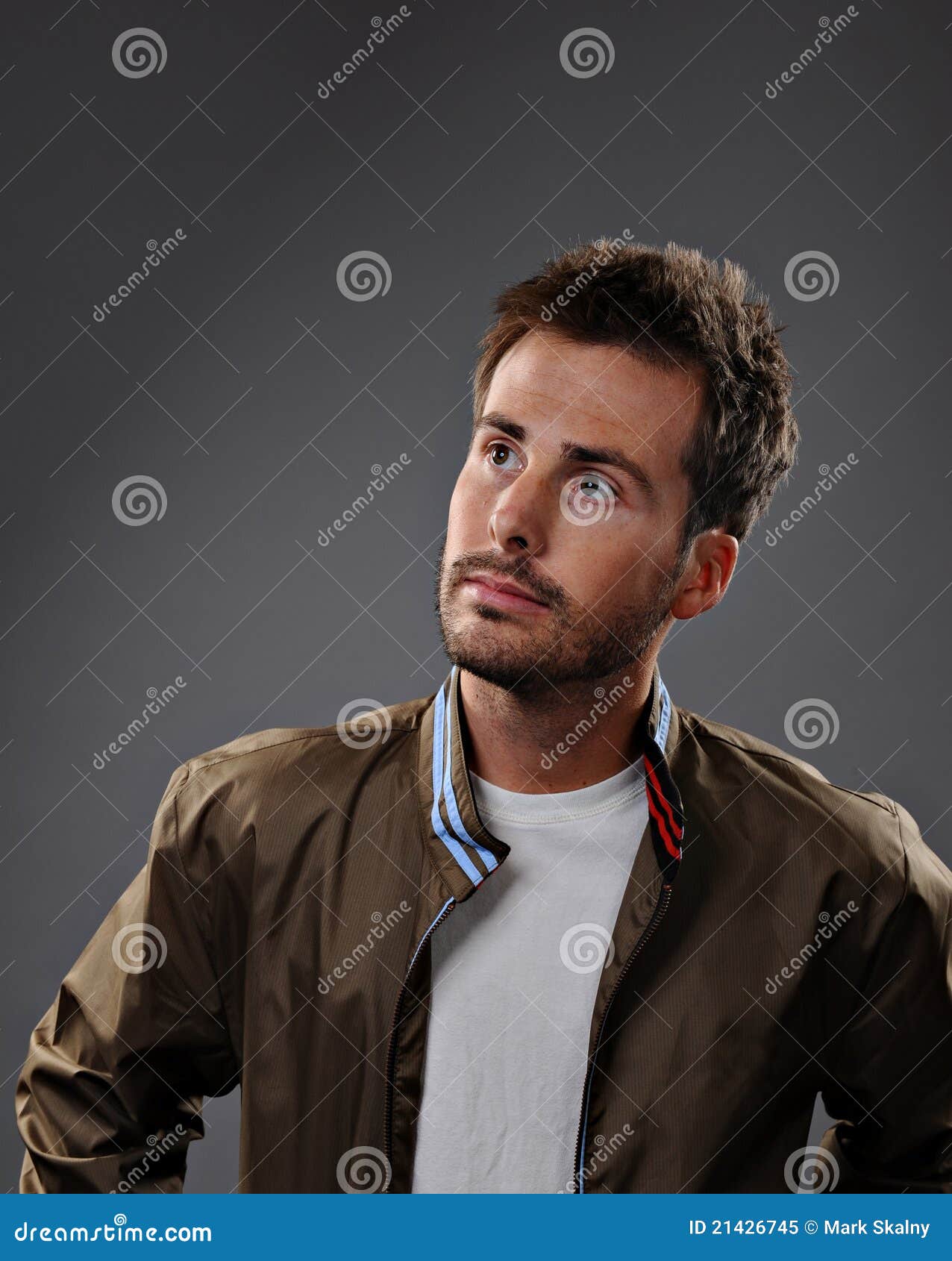 Attractive Young Man Looking Up To His Right. Stock Image - Image of ...