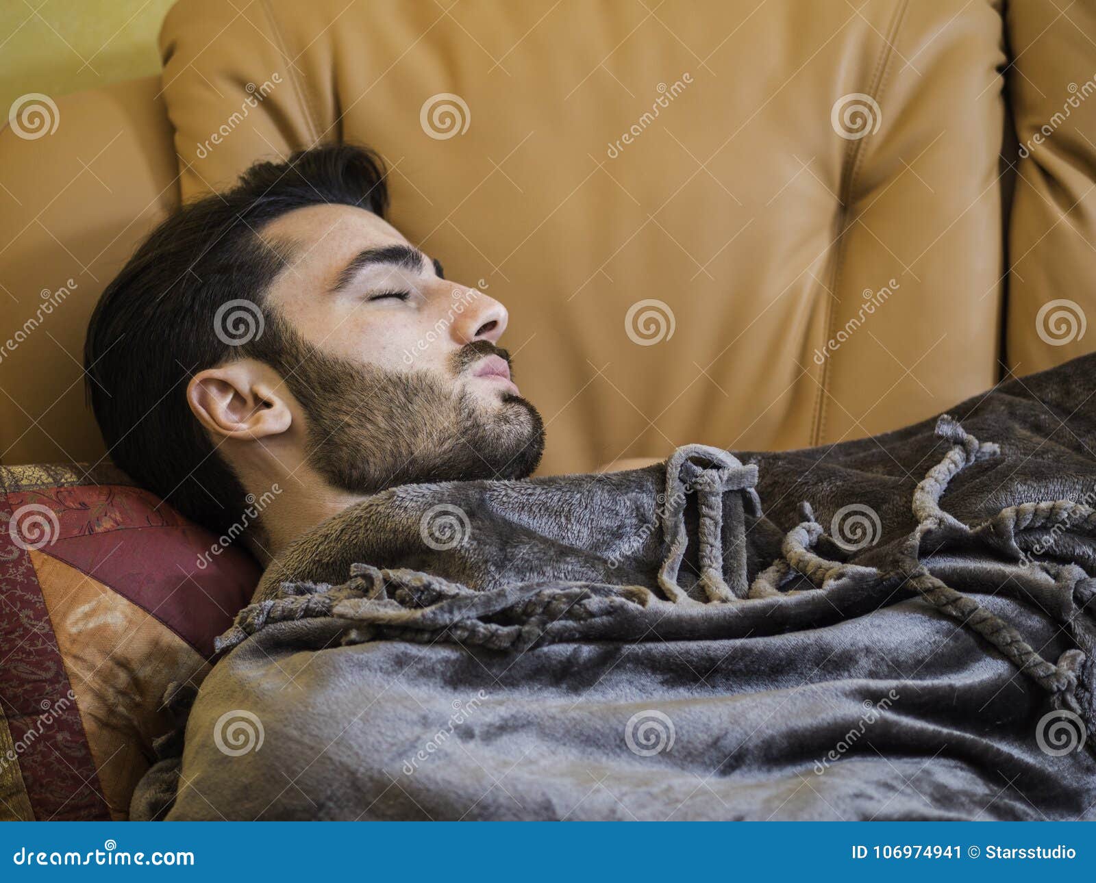 Young Man Lying Alone on a Couch, Sleeping Stock Image - Image of cold ...