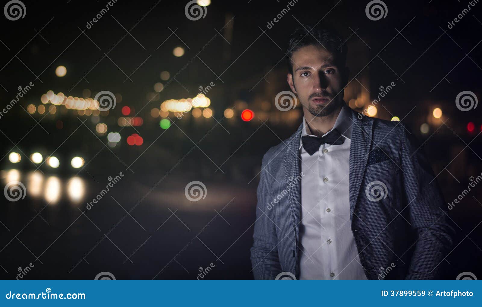 Attractive Young Man at Night with City Lights Behind Him Stock Image ...
