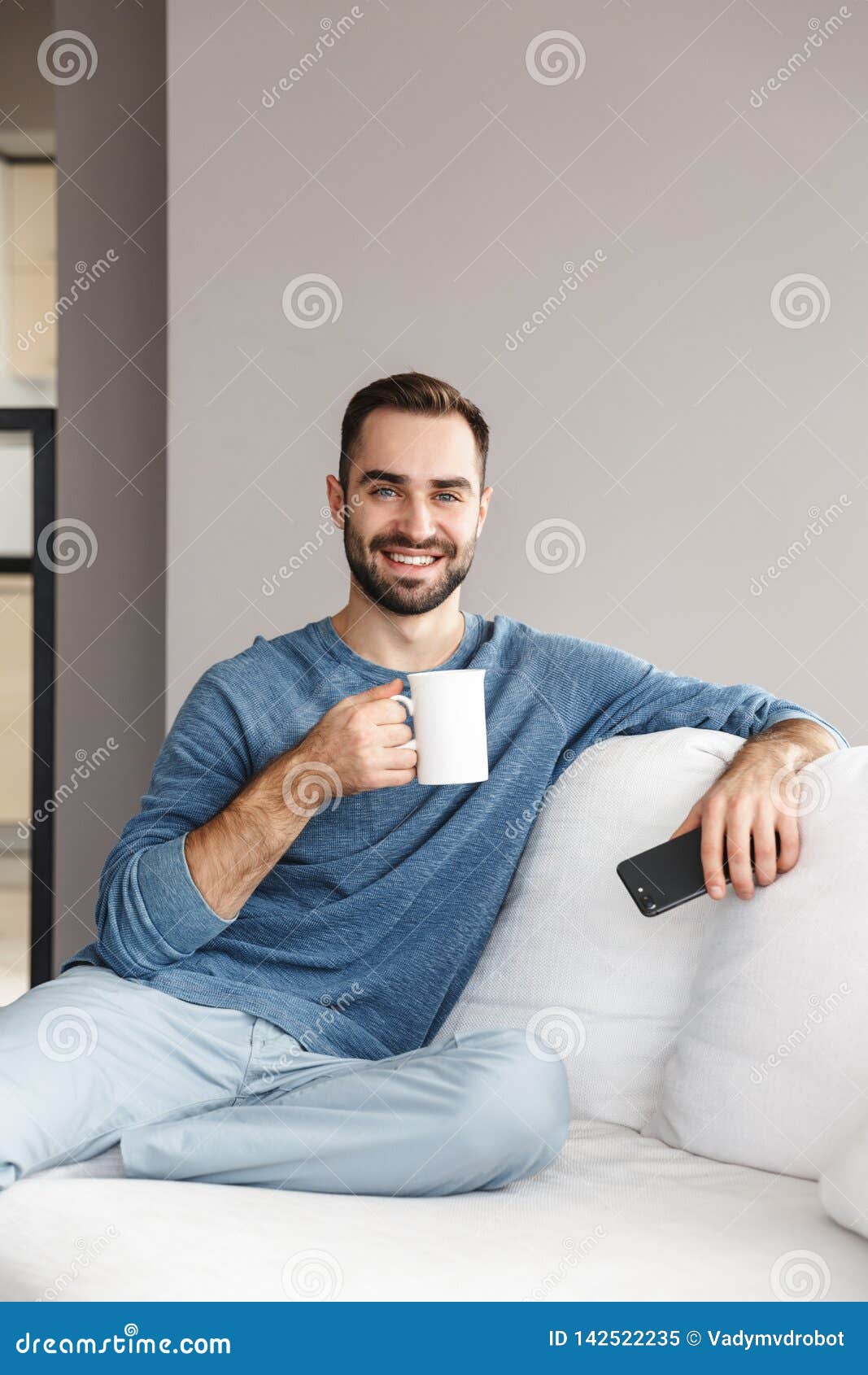 Attractive Young Man Relaxing Stock Image - Image of couch ...