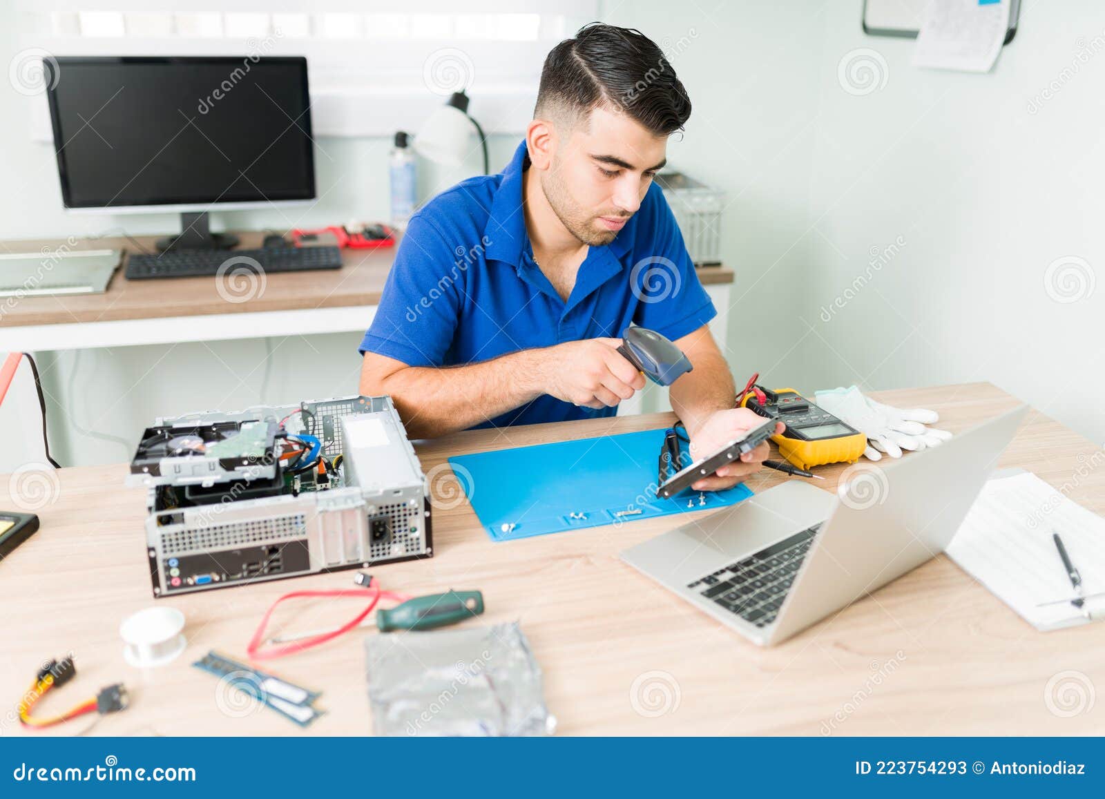 Attractive Young Man Searching for a Computer Piece Stock Image - Image ...