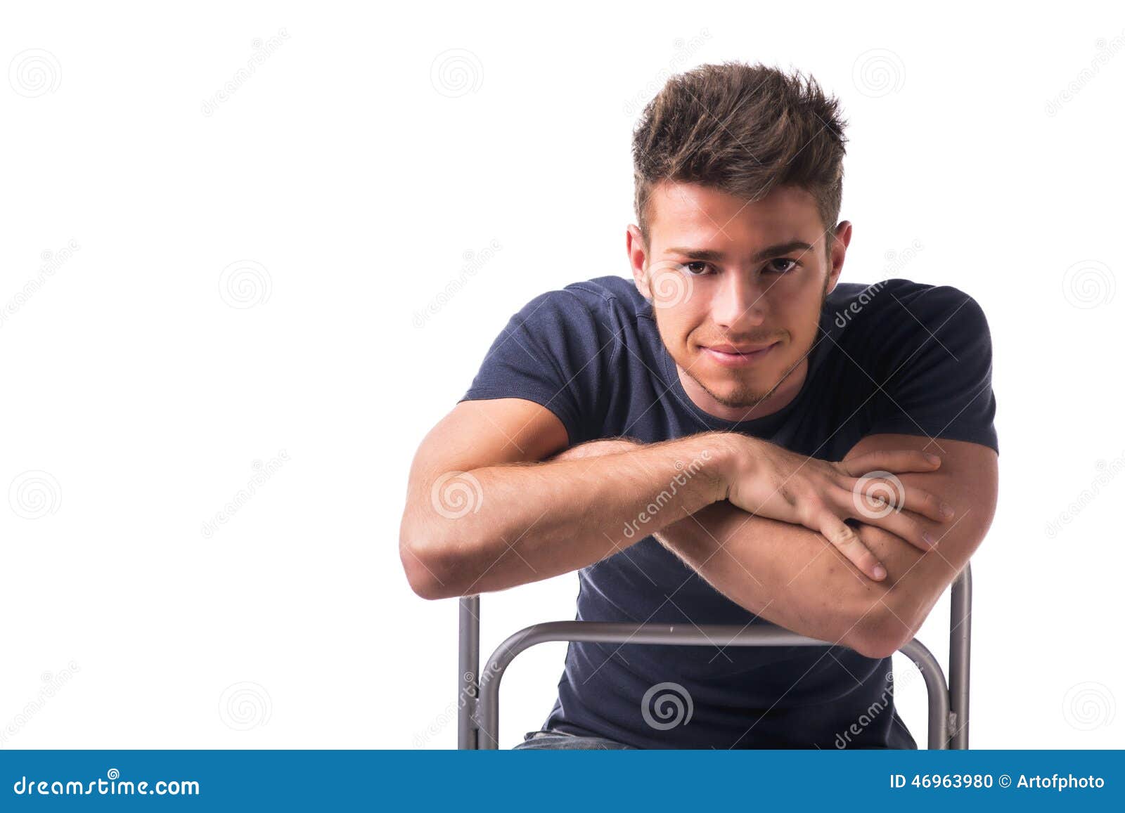 Attractive Young Man Sitting, Leaning on Back of a Chair Stock Photo ...