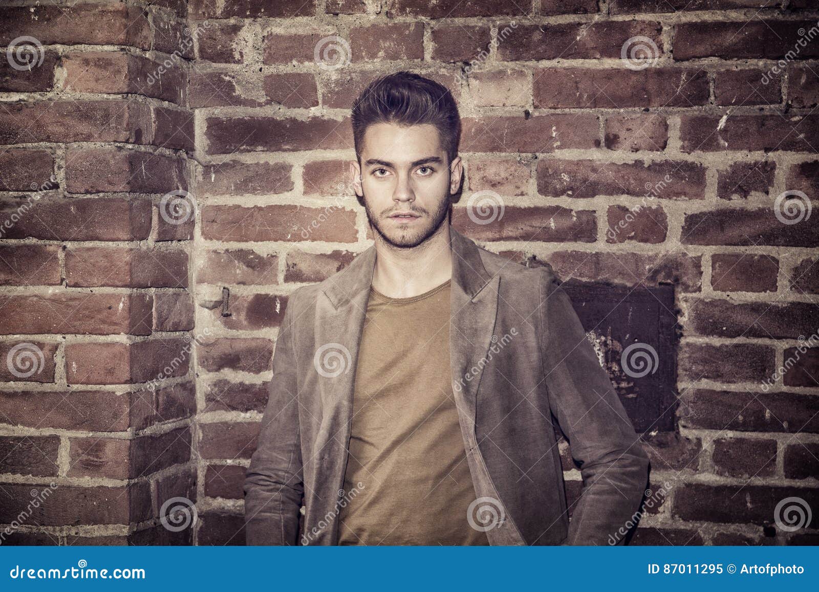 Attractive Young Man Standing Against Brick Wall Stock Image - Image of ...