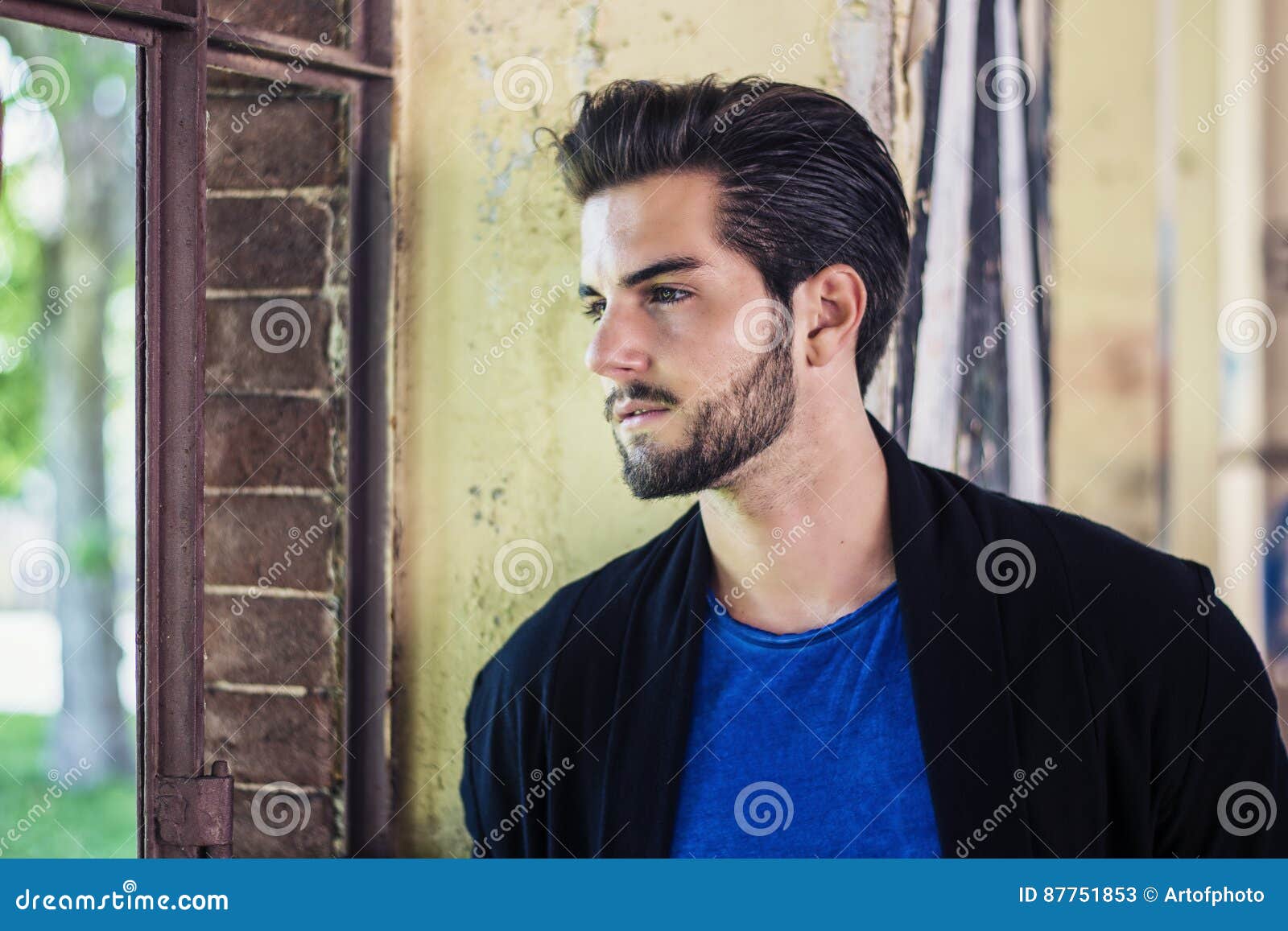 Attractive Young Man Standing Against Brick Wall Stock Image - Image of ...
