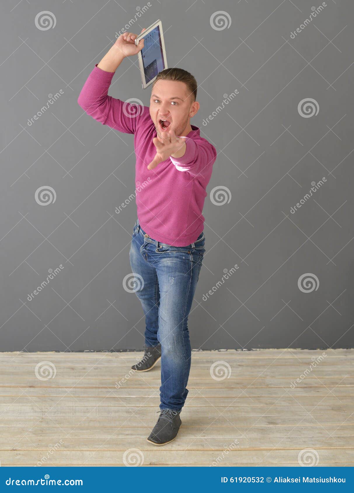 Attractive Young Man Standing and Holding Plane-table Stock Photo ...