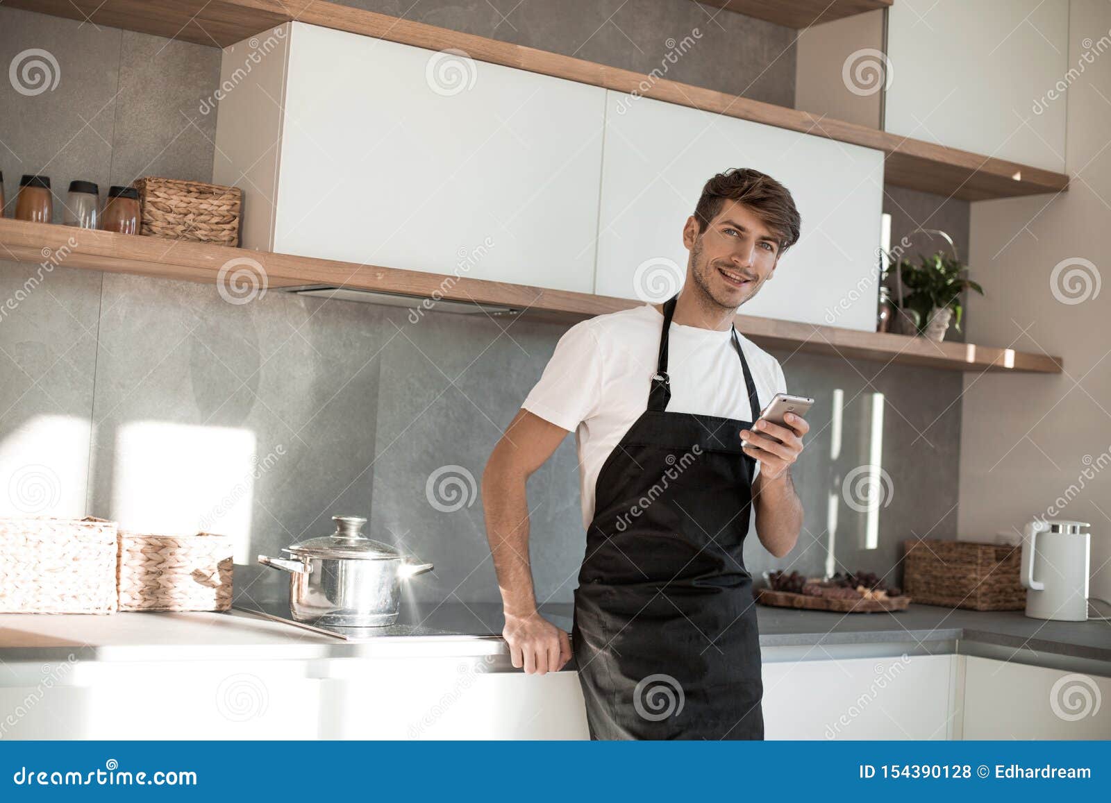 Attractive Young Man Standing Near the Kitchen Table Stock Photo ...