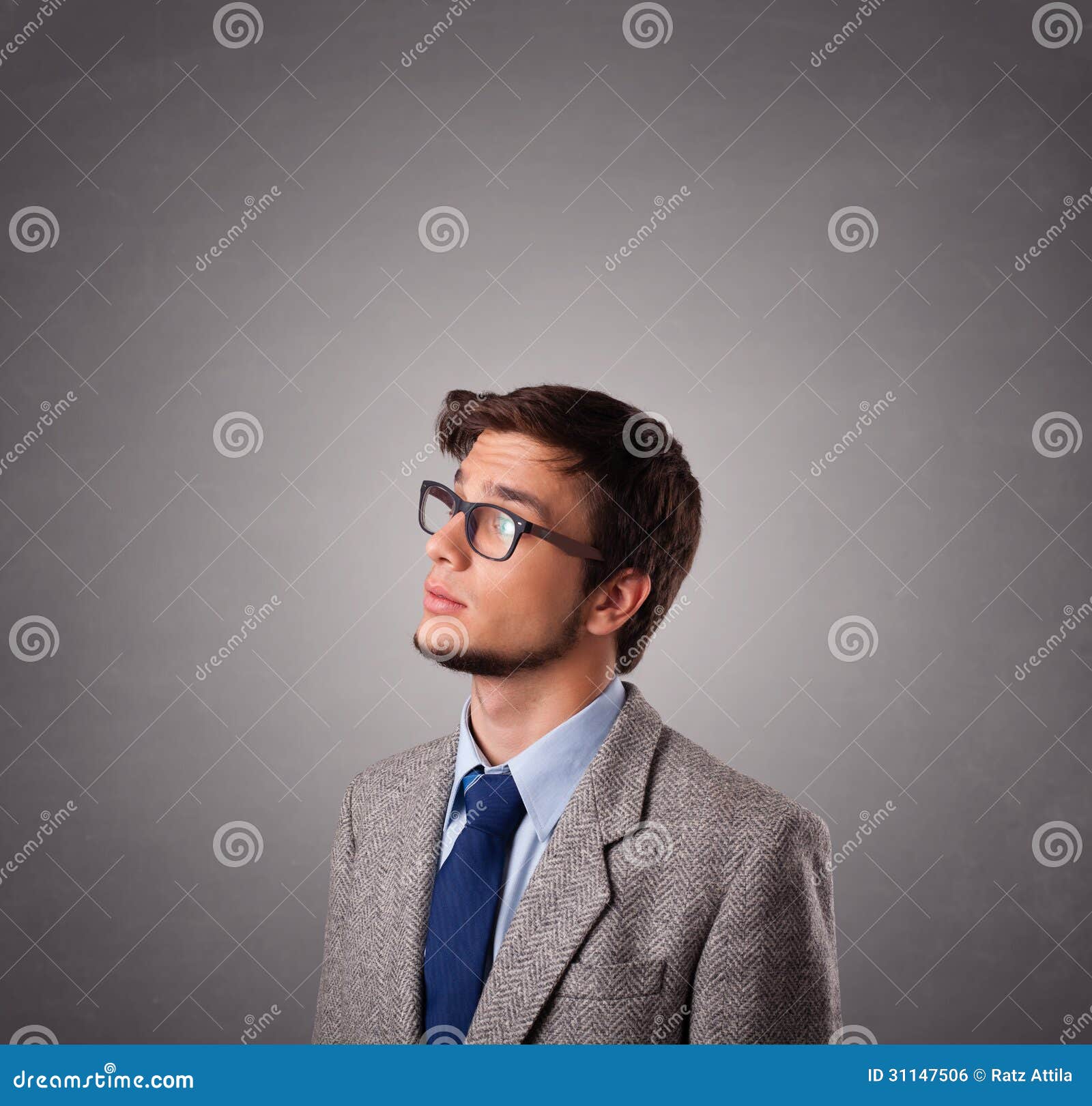Attractive Young Man Standing and Thinking with Copy Space Stock Photo ...