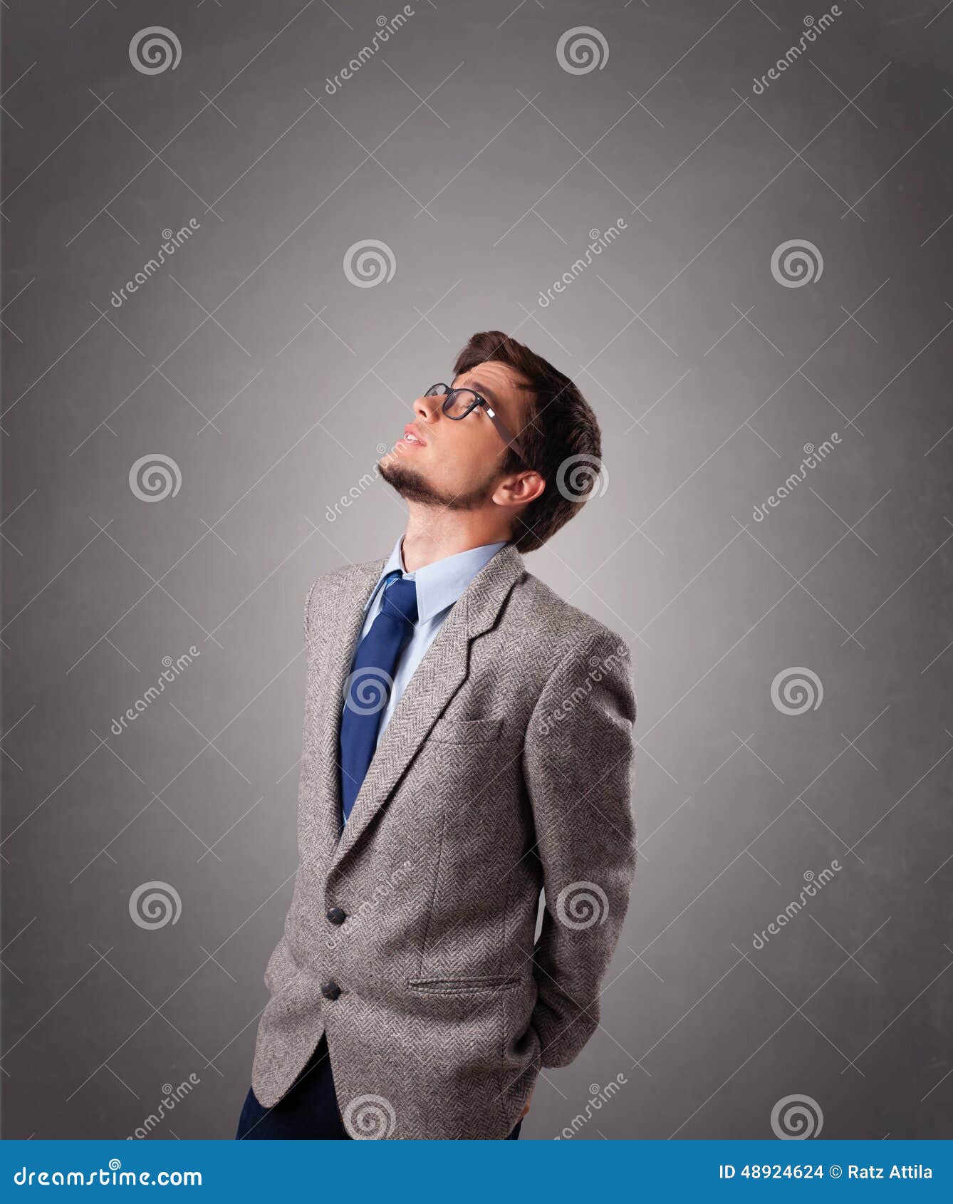 Attractive Young Man Standing and Thinking with Copy Space Stock Photo ...