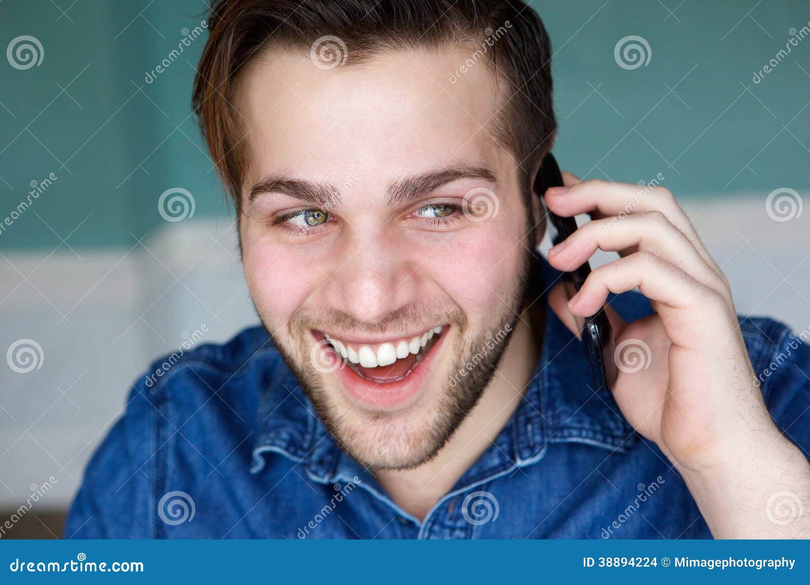 Attractive Young Man Talking on Phone Stock Photo - Image of face ...