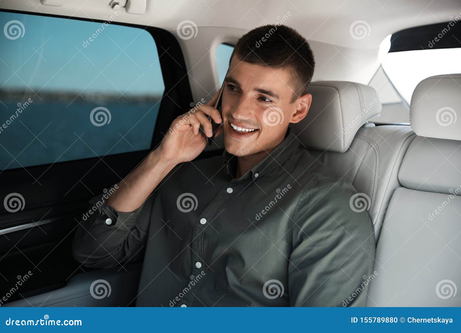 Attractive Young Man Talking on Phone in Car Stock Photo - Image of ...
