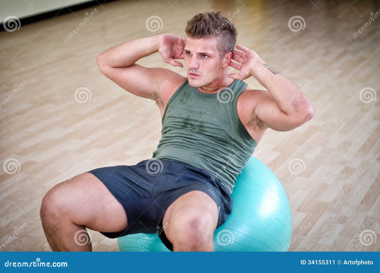Attractive Young Man Using Exercise Ball in a Gym Stock Image - Image ...