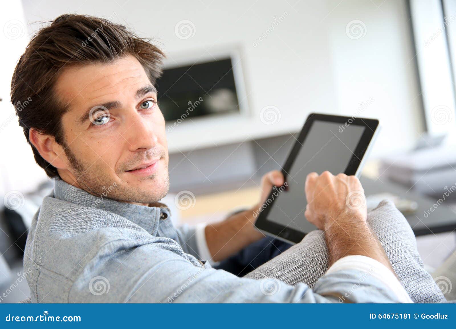 Attractive Young Man Using Tablet at Home Stock Image - Image of tablet ...