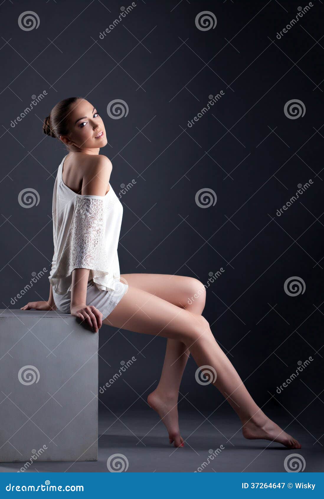 Attractive Young Model Posing Sitting on Cube Stock Image - Image of ...