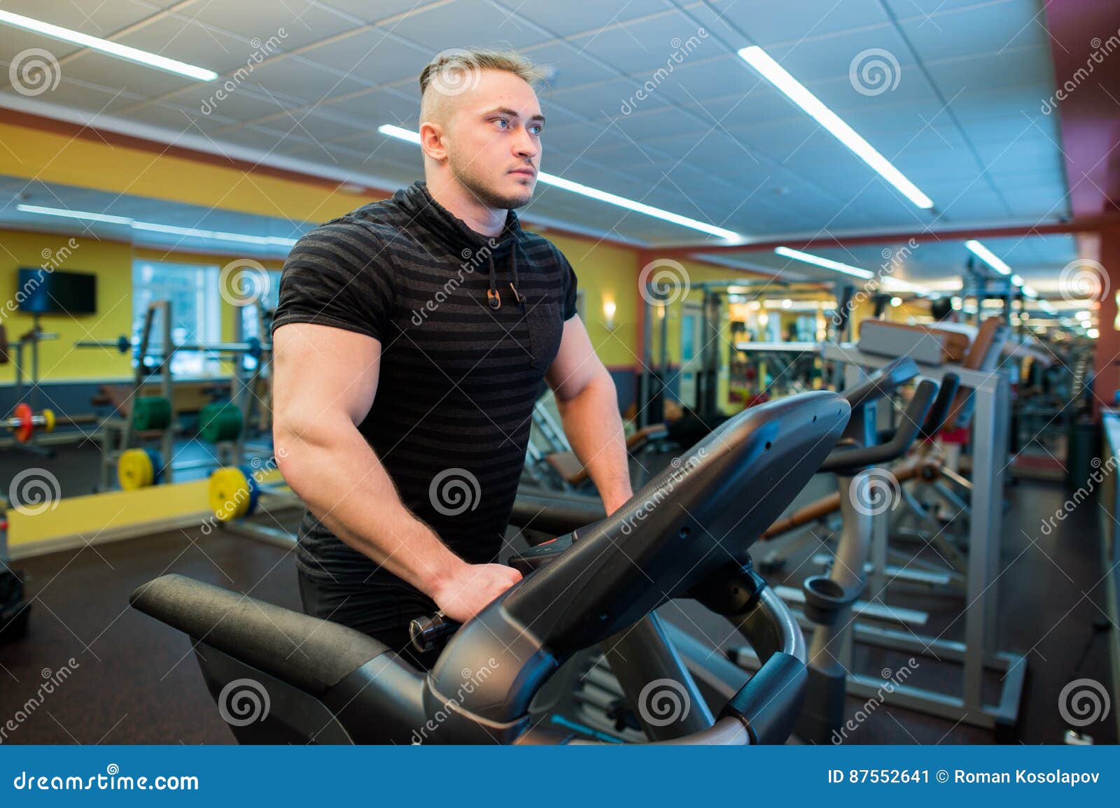 Attractive Young Muscular Man while Running on a Treadmill in Gym Stock ...