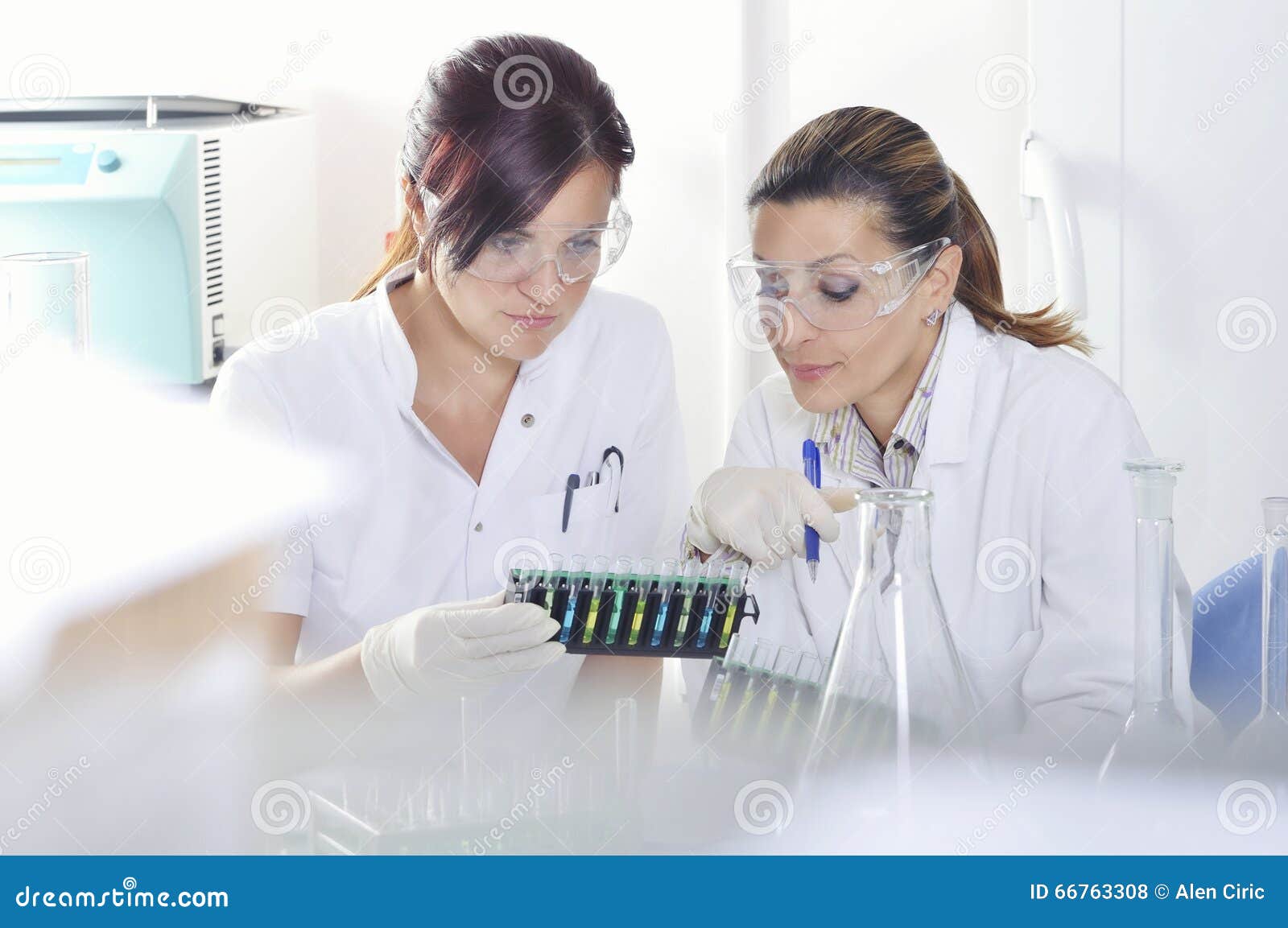 Attractive Young PhD Students Scientists Observing the Color Shift ...