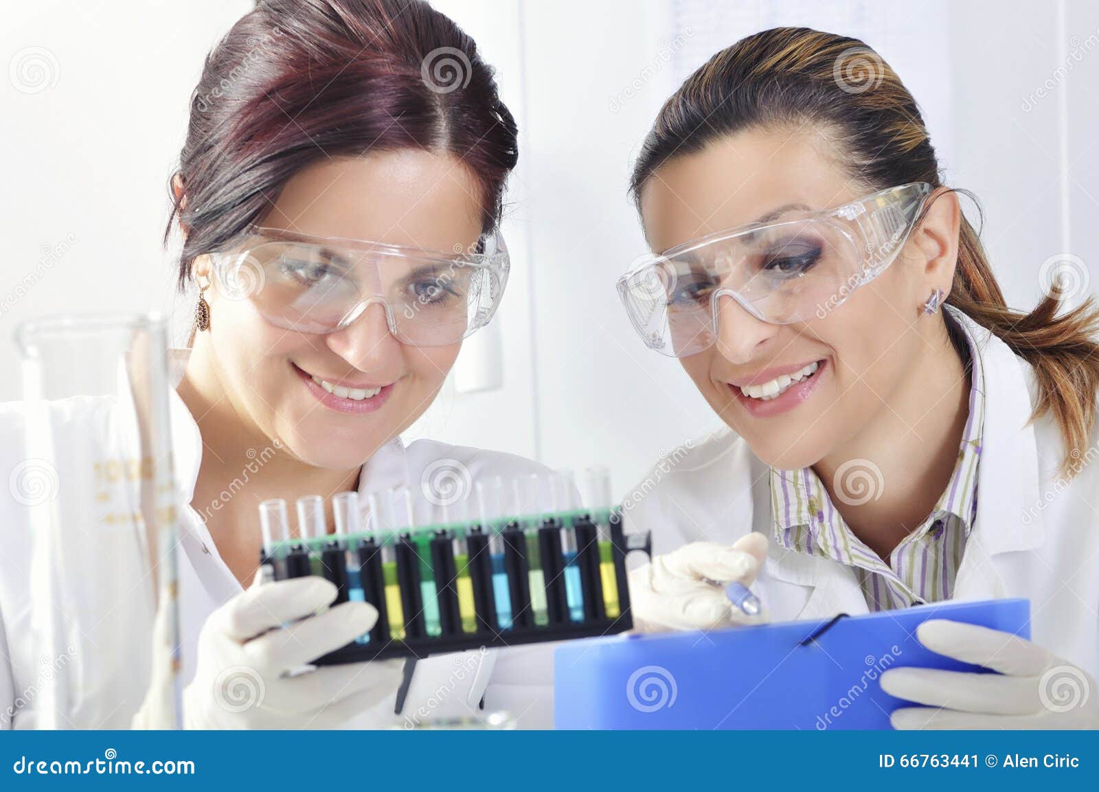 Two Scientists Observing Something With Microscope Stock Photo ...