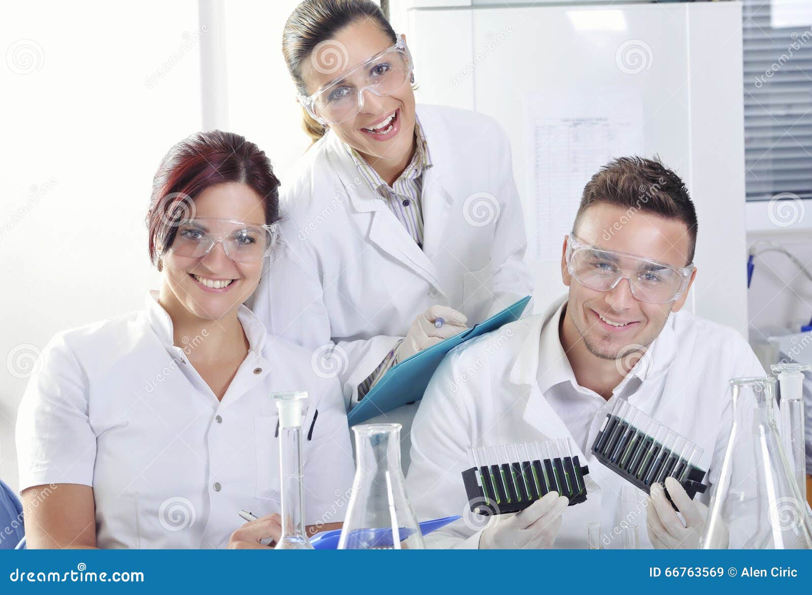 Attractive Young PhD Students Scientists Observing The Color Shift ...